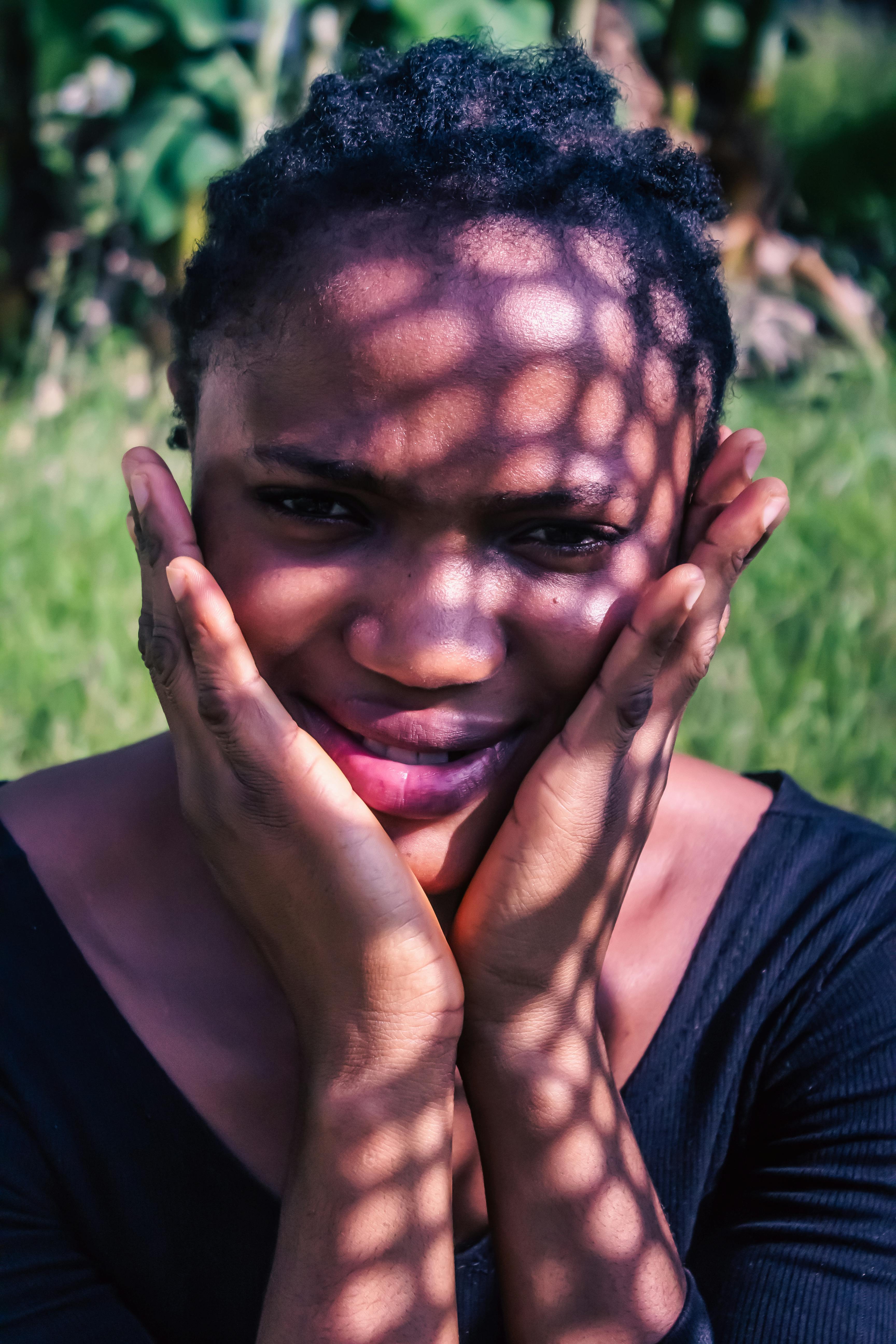 Woman with Dappled Shadow in Sunlit Garden · Free Stock Photo