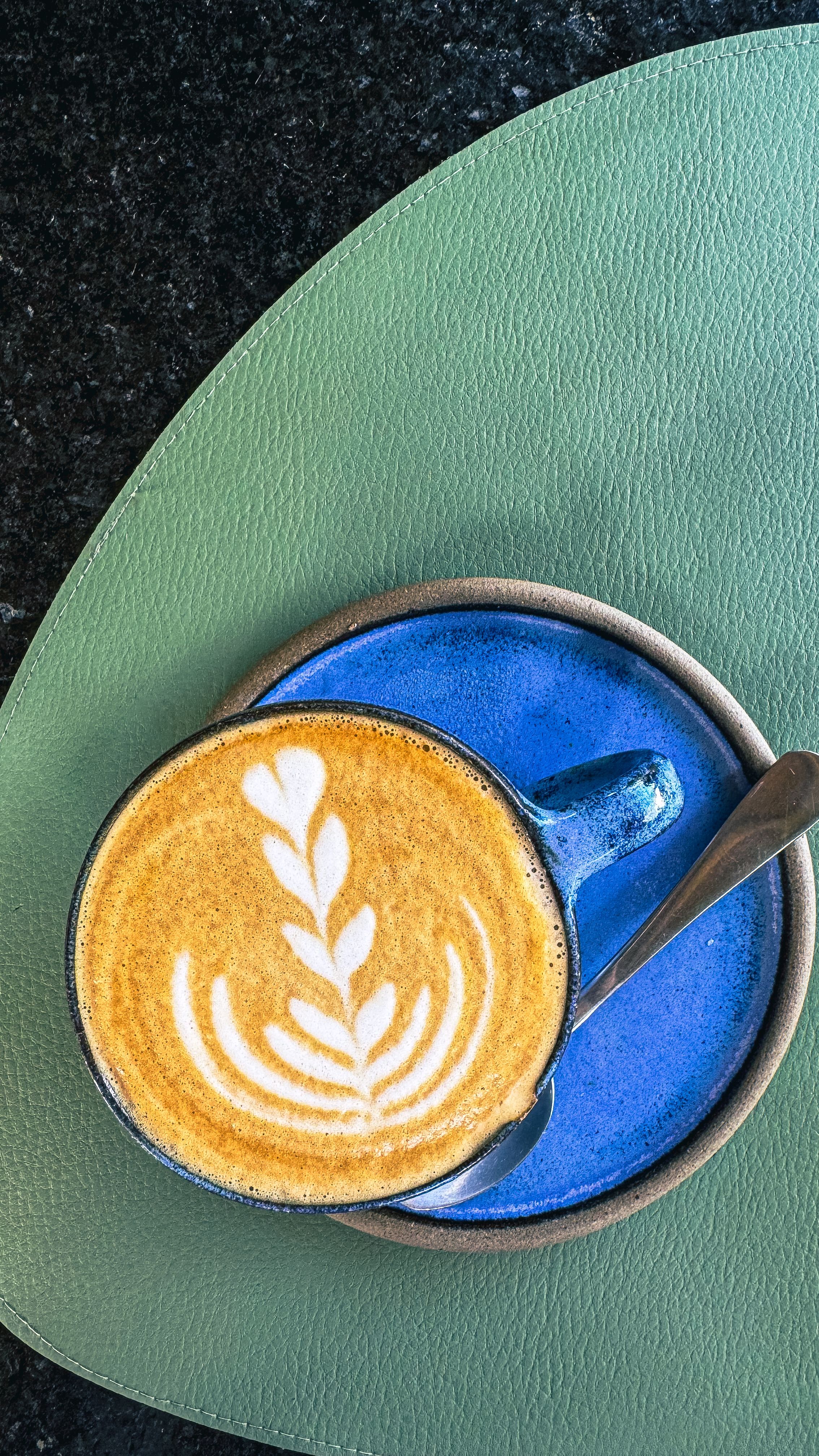 Artistic Latte with Leaf Latte Art on Colorful Mat · Free Stock Photo