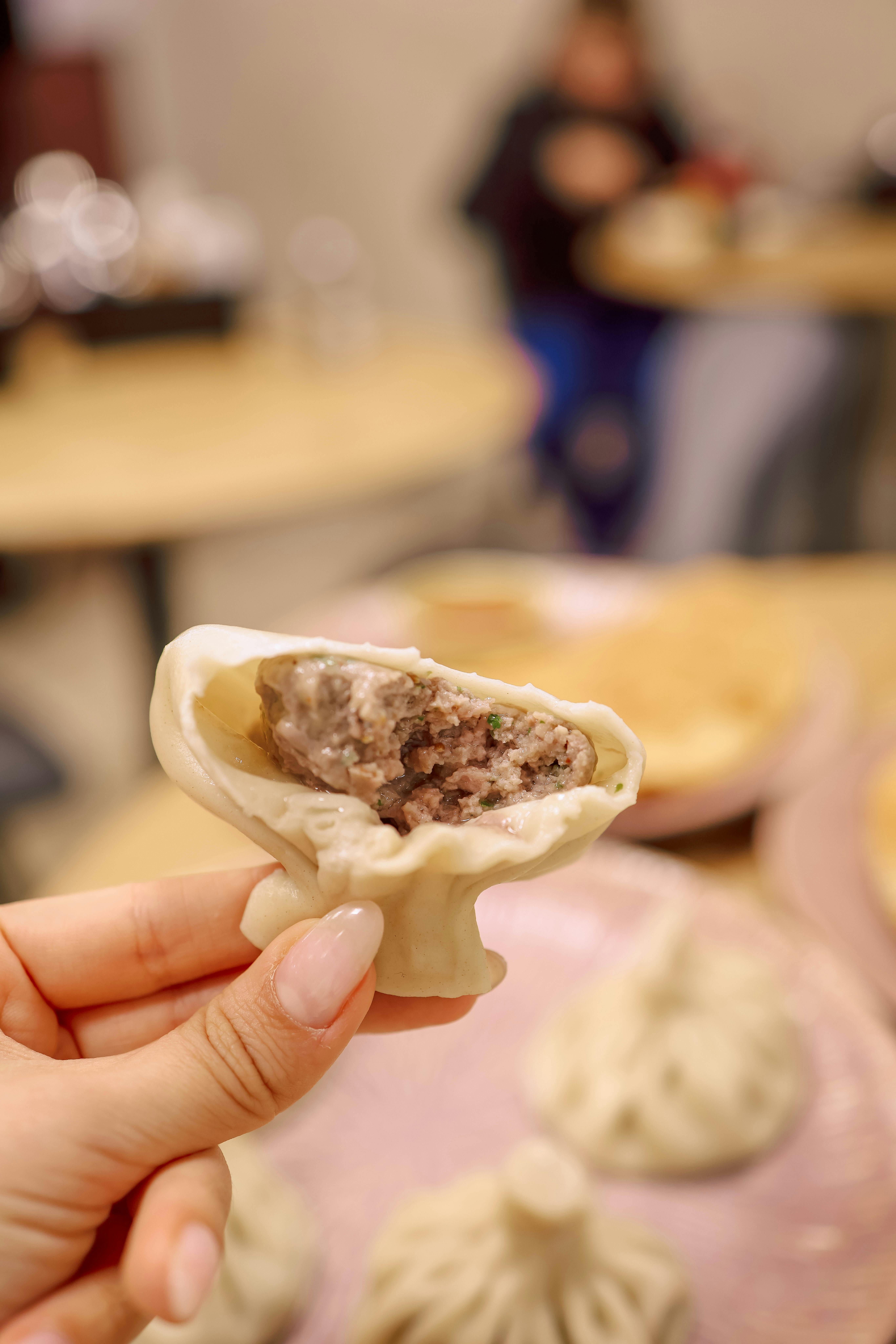 Close-up of Half-Eaten Dumpling with Filling · Free Stock Photo