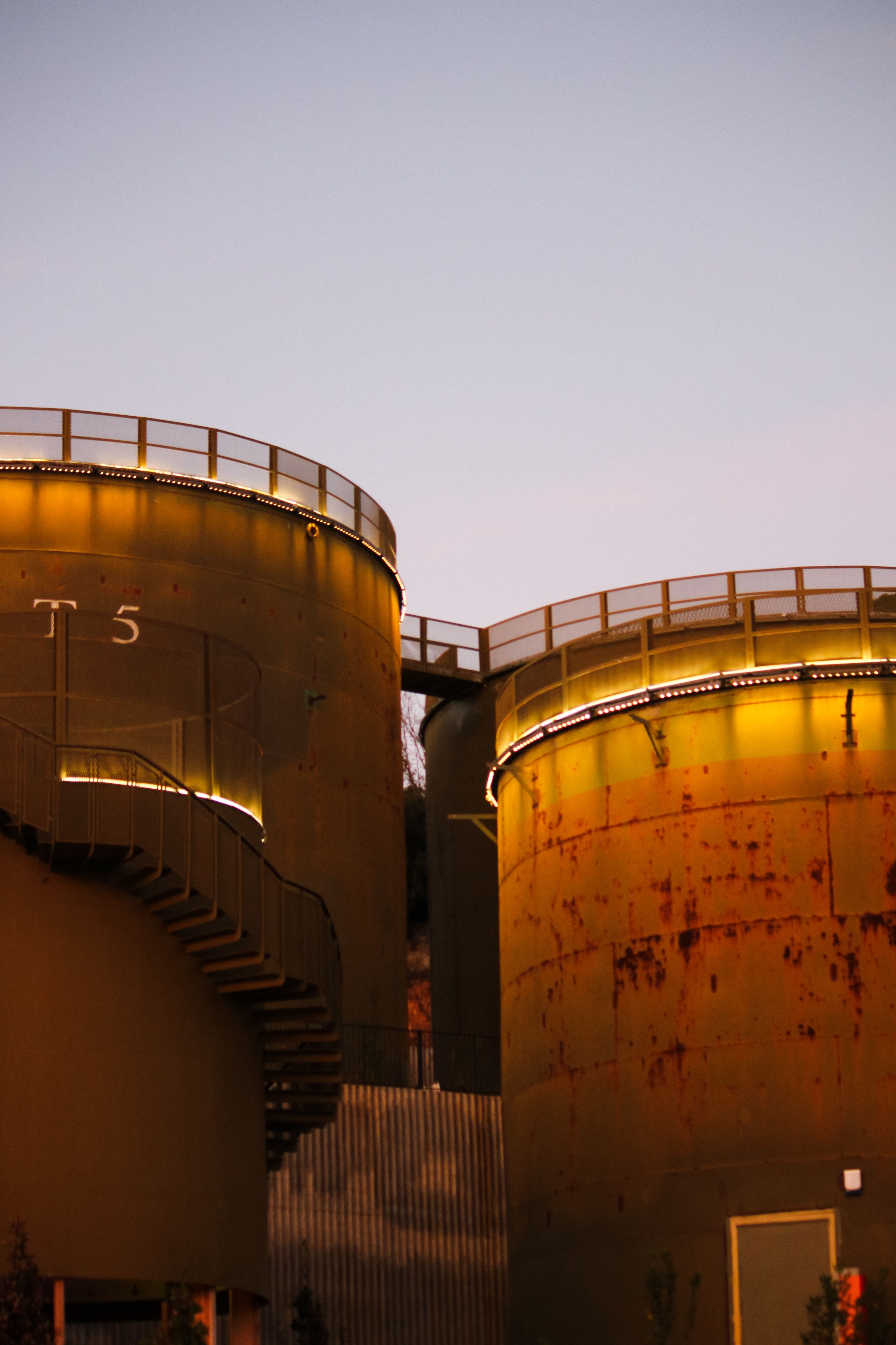 Industrial Silos at Dusk with Rust Texture · Free Stock Photo