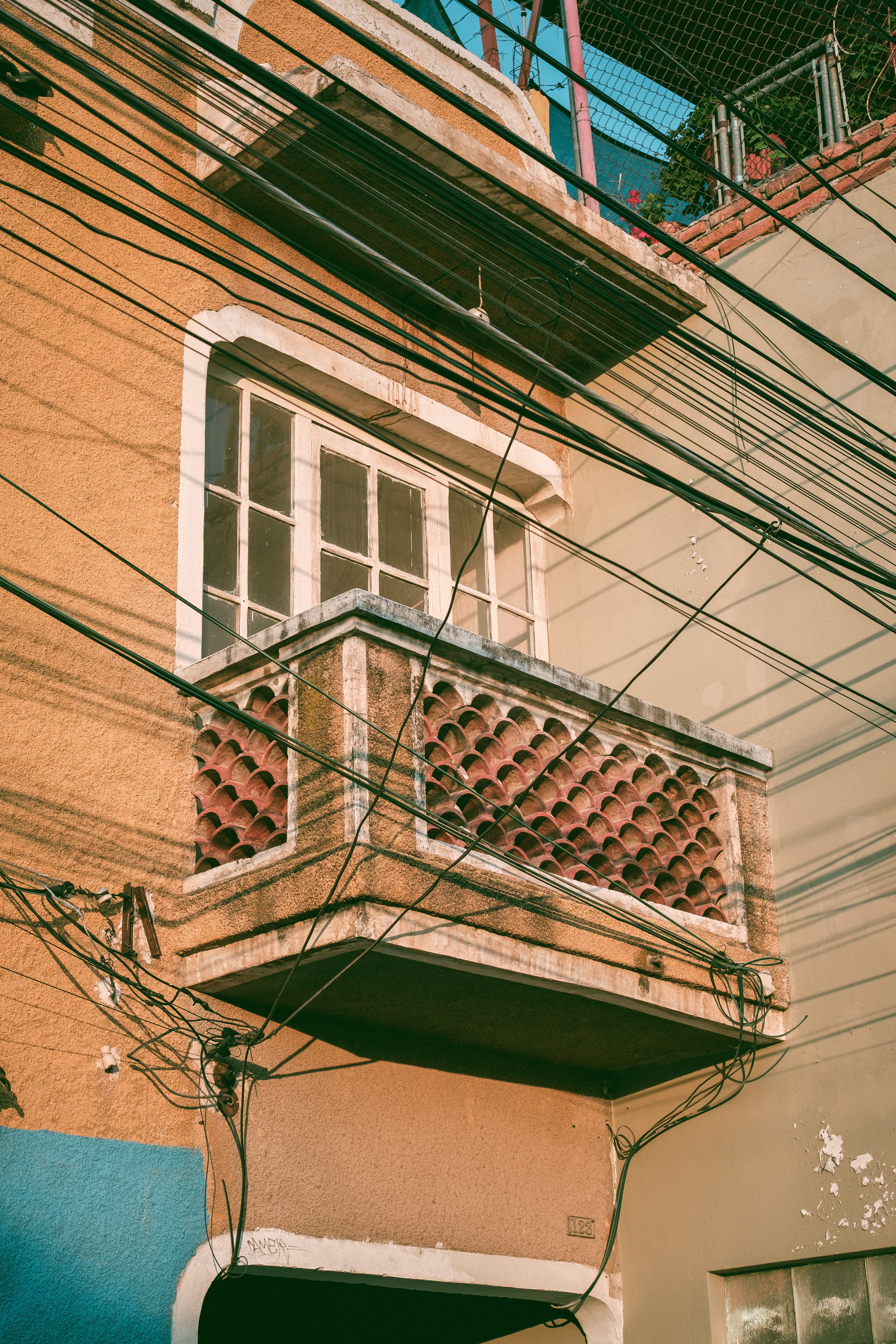 Balcony with Wire Mesh in Urban Setting · Free Stock Photo