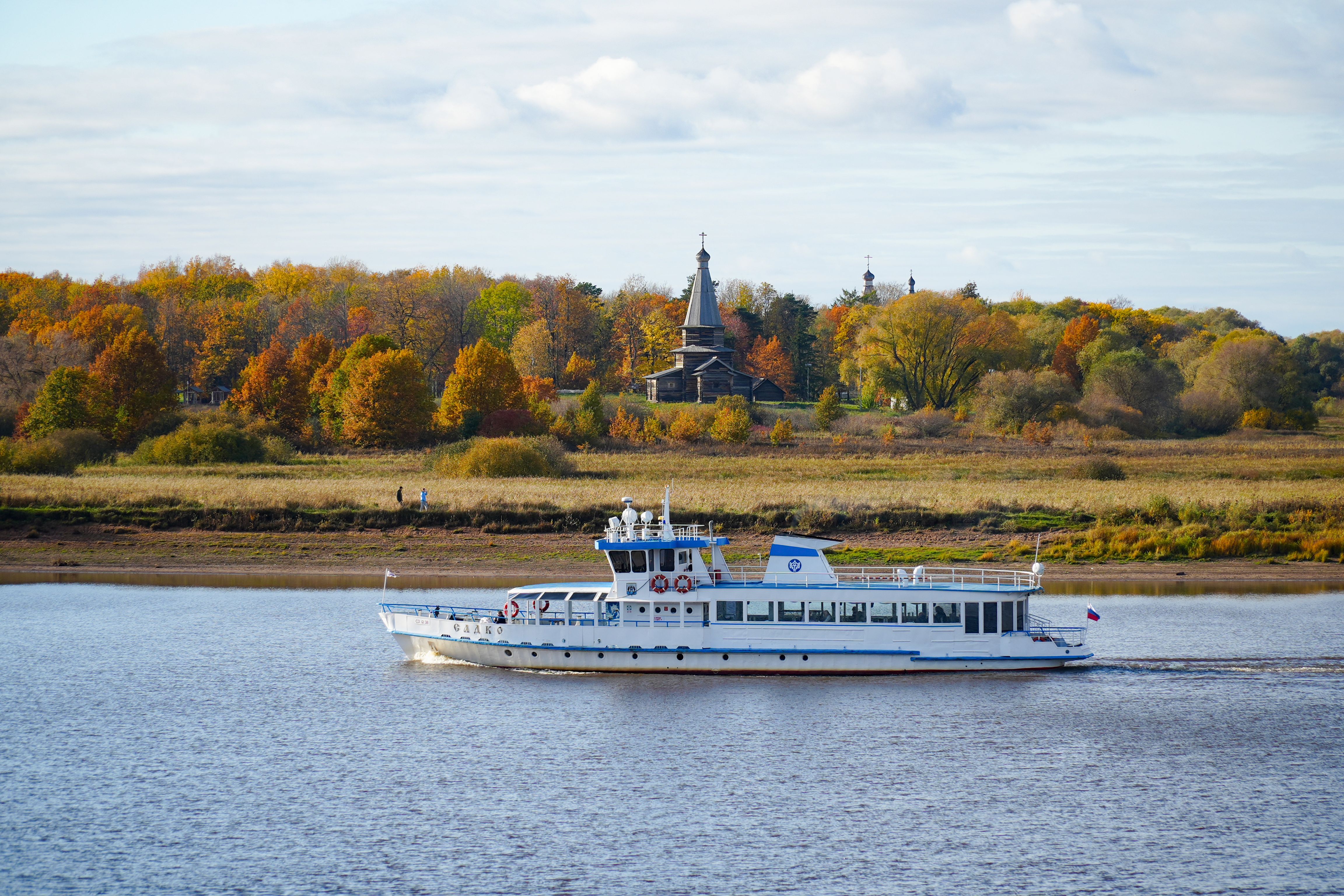 Scenic River Landscape with Boat in Autumn · Free Stock Photo