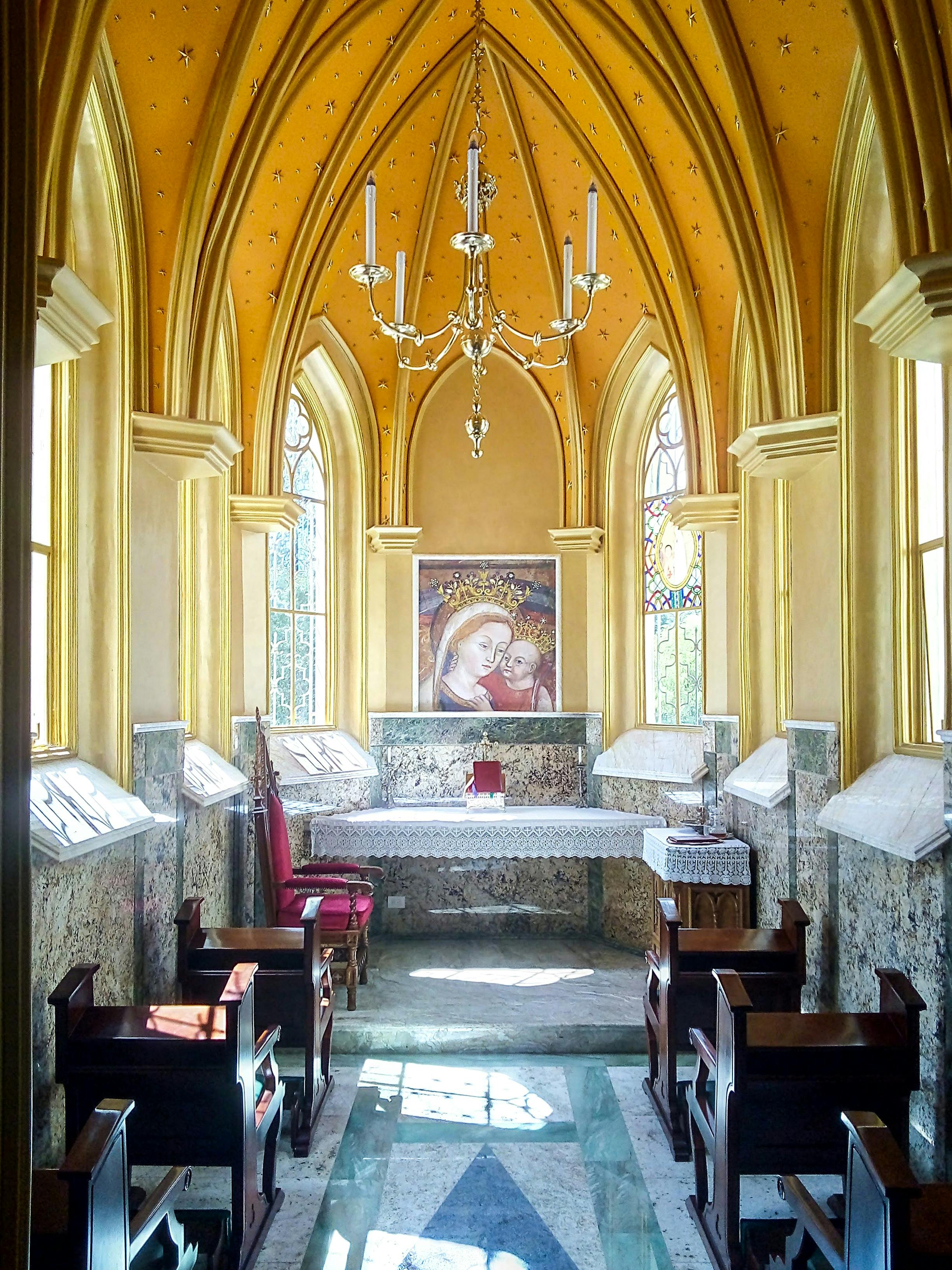 Elegant Chapel Interior with Stained Glass Windows · Free Stock Photo