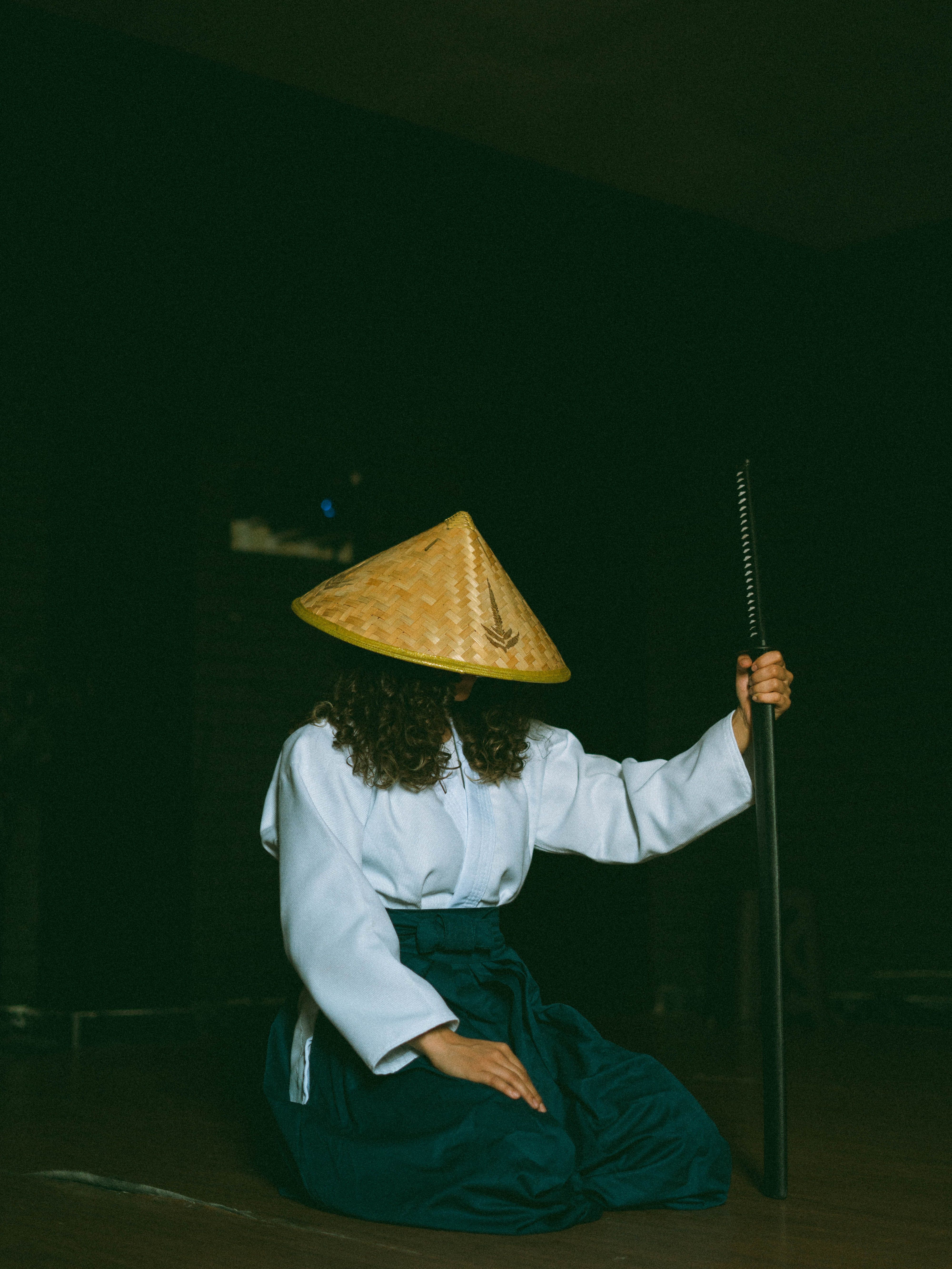 Traditional Samurai Ritual with Sword and Hat · Free Stock Photo