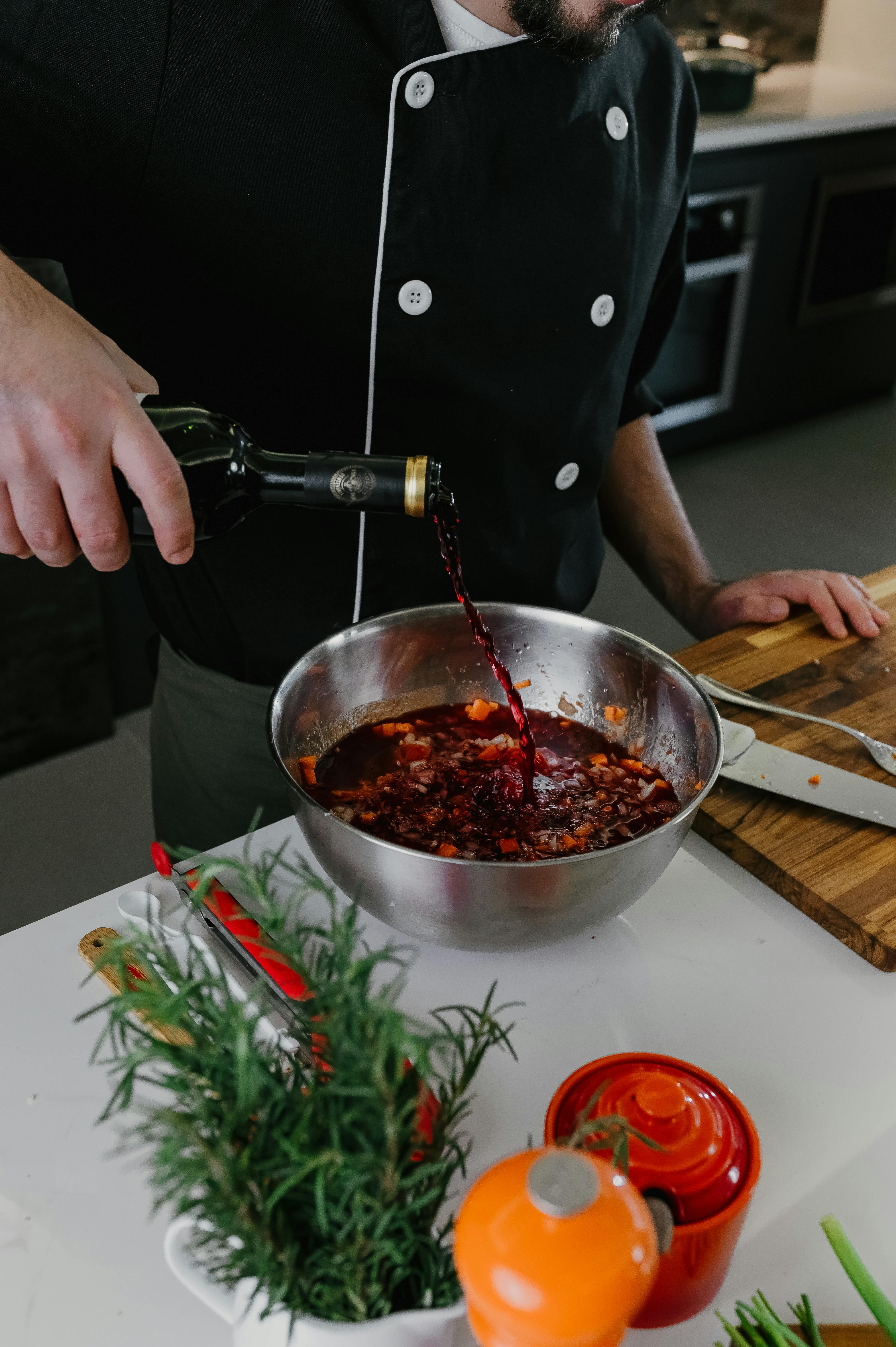 Chef Preparing Sauce with Red Wine in Kitchen · Free Stock Photo