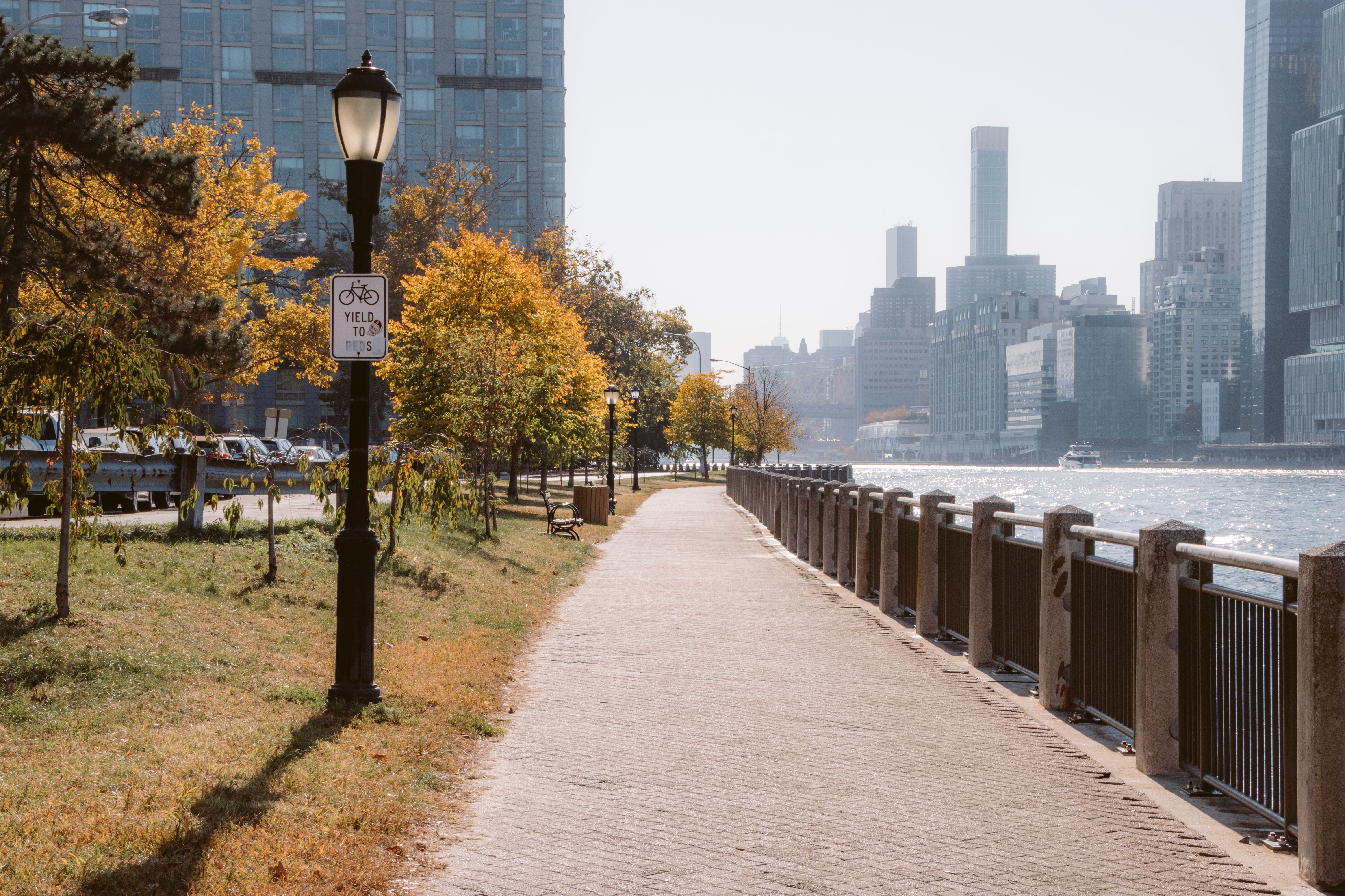 Scenic Autumn Riverside Walkway in NYC · Free Stock Photo