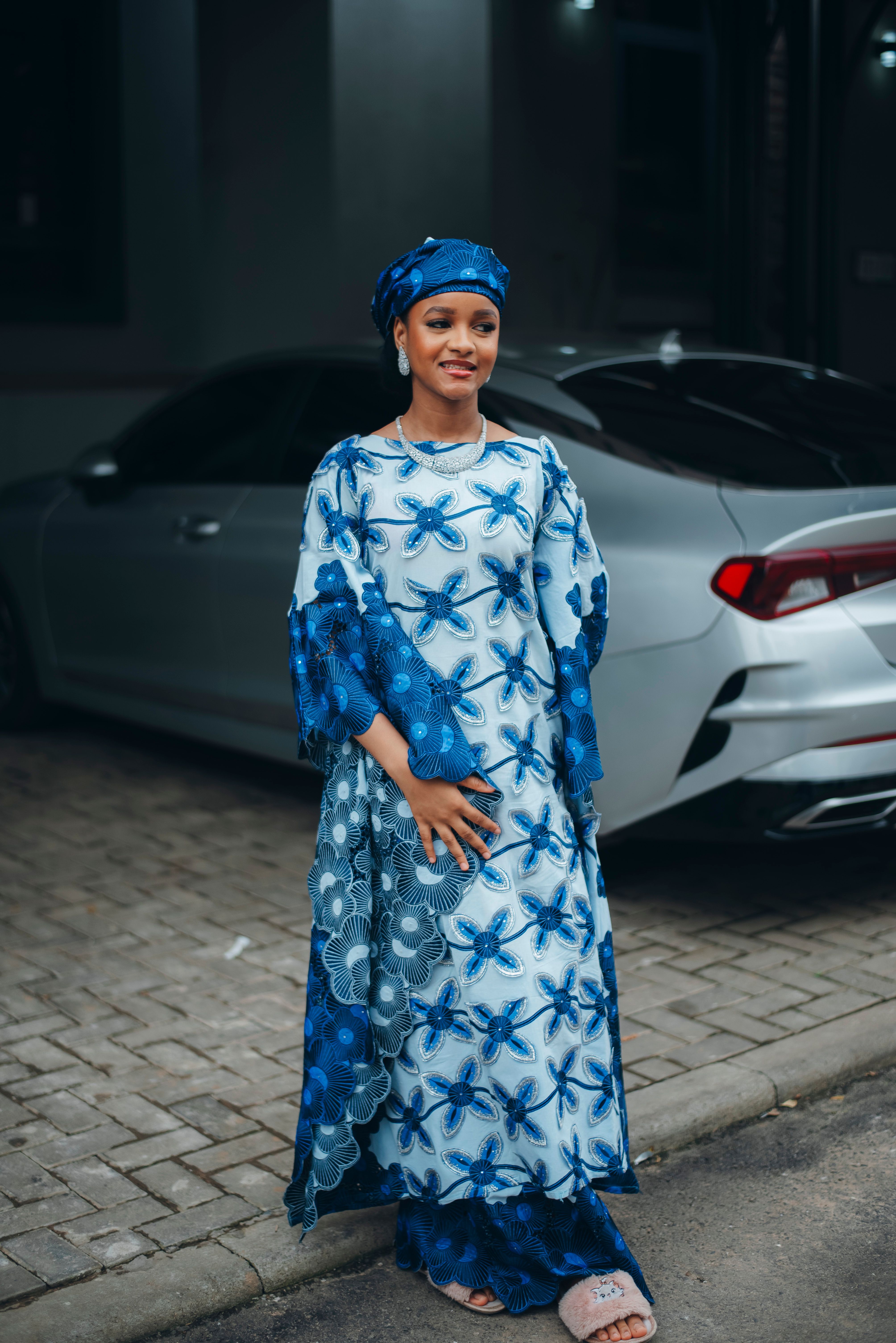 Elegant Woman in Blue Traditional Attire Outdoors · Free Stock Photo
