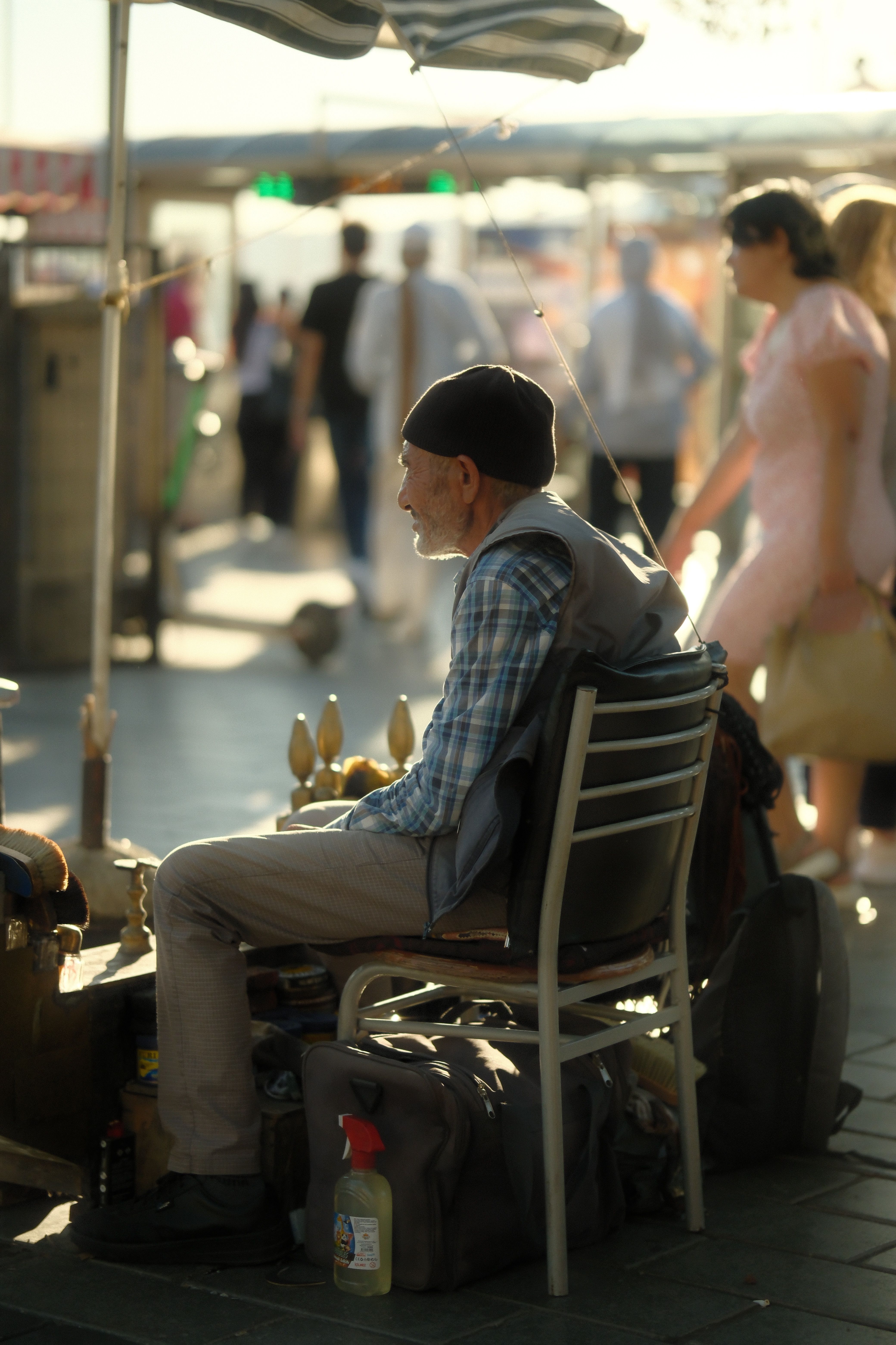 Elderly Man Street Vendor at Outdoor Market · Free Stock Photo