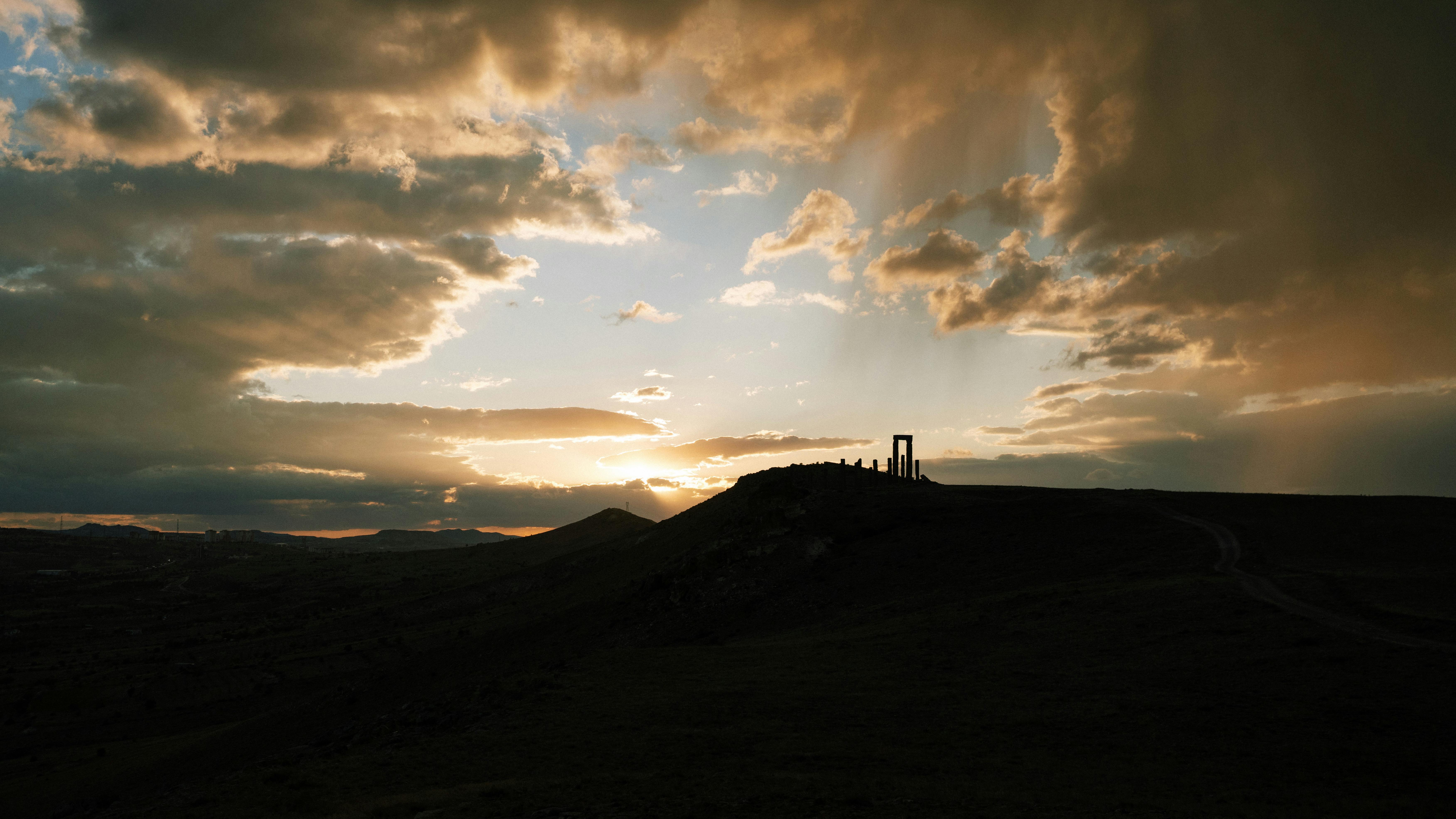 Dramatic Sunset Over Ancient Ruins Landscape · Free Stock Photo