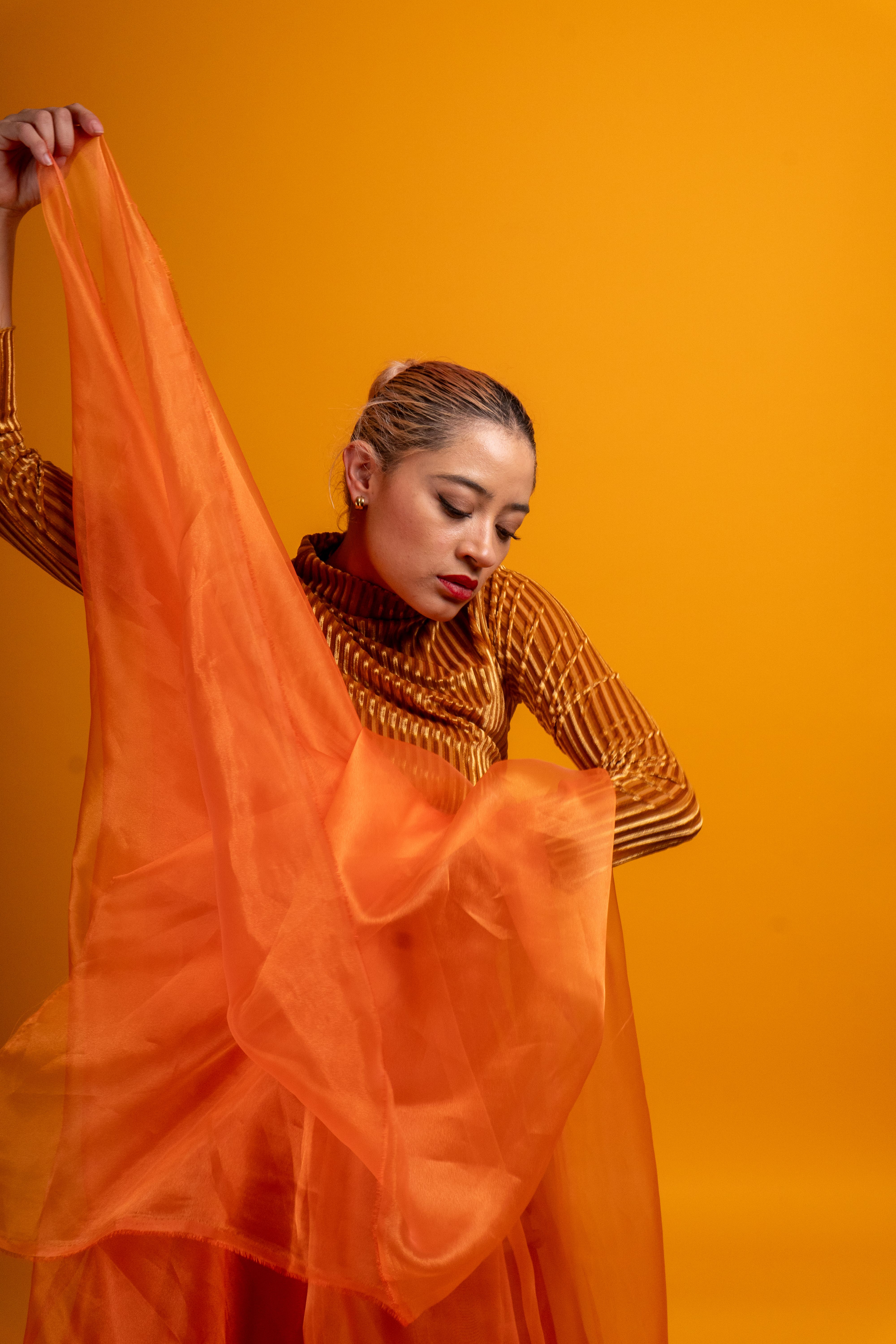 Dynamic Portrait of a Contemporary Dancer in Orange · Free Stock Photo