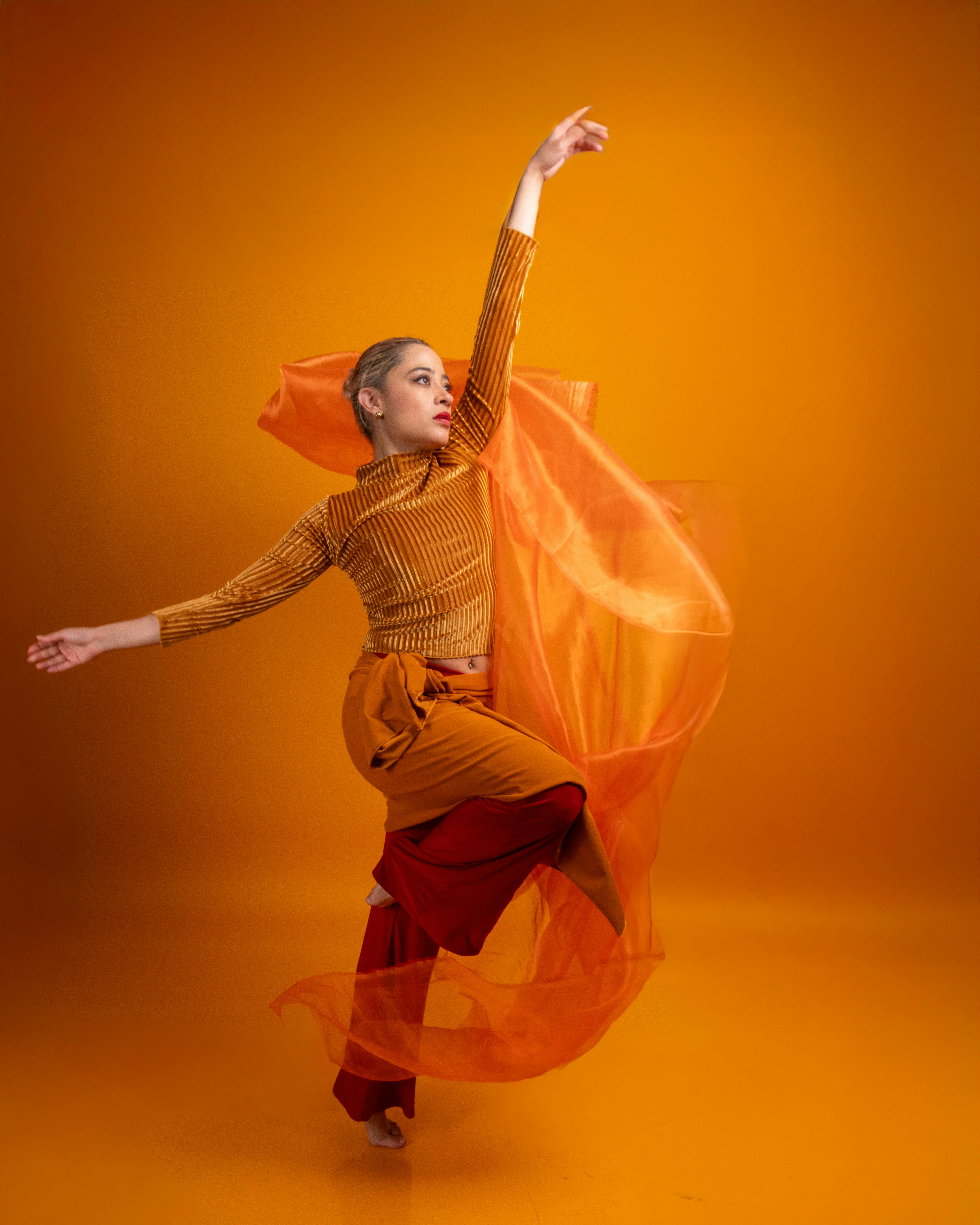 Dynamic Contemporary Dancer in Orange Setting · Free Stock Photo
