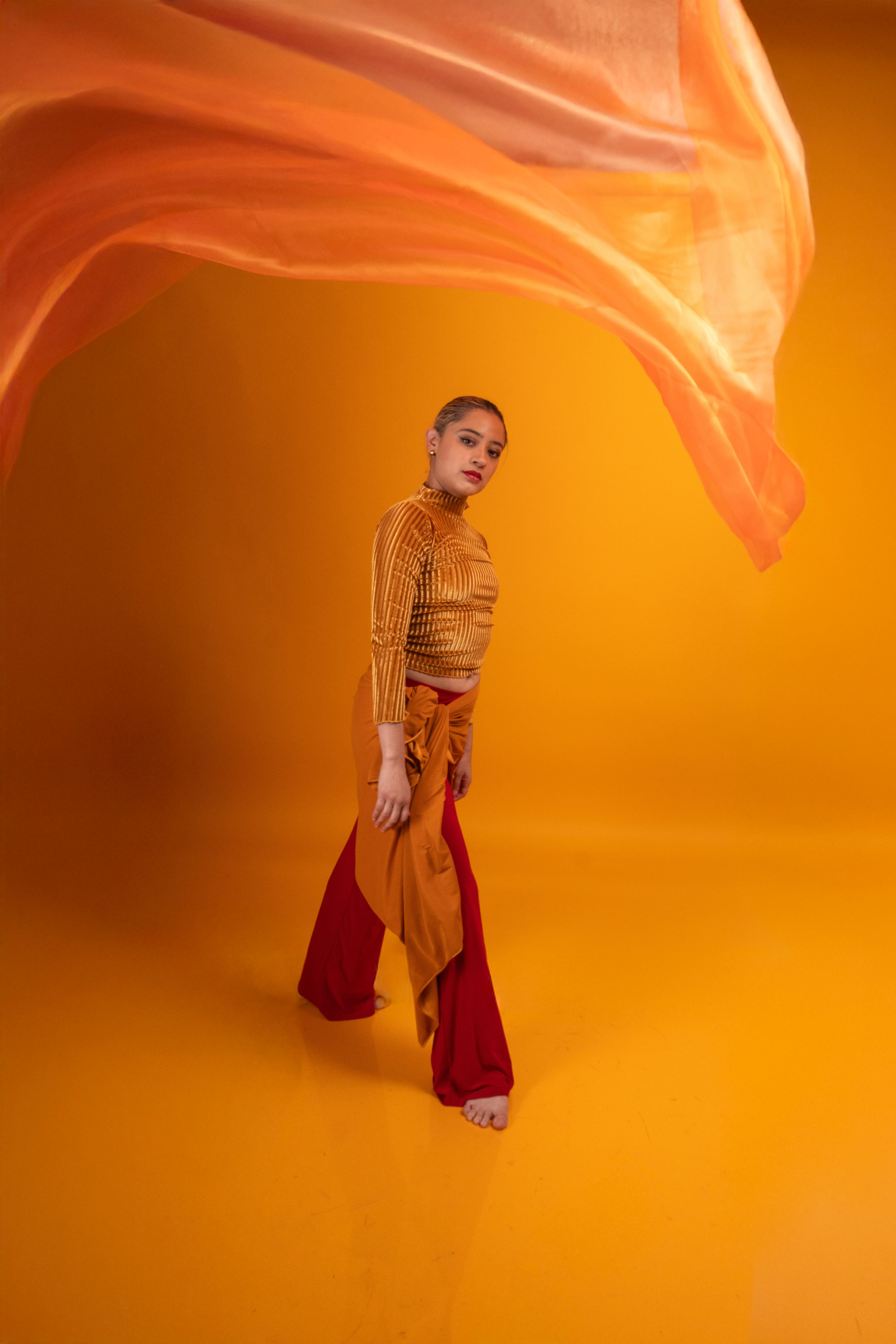 Graceful Ballet Dancer in Flowing Orange Fabric · Free Stock Photo
