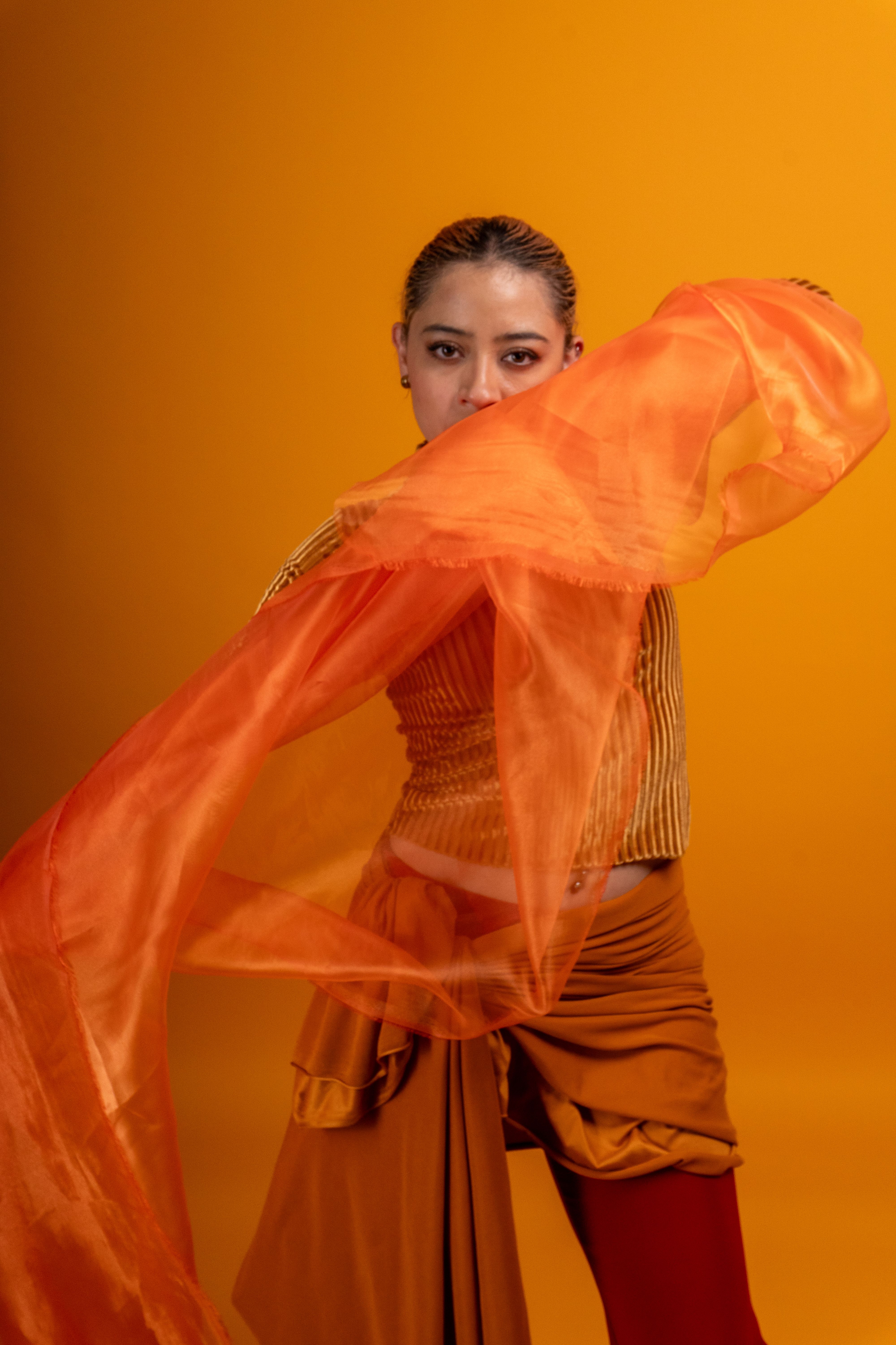 Elegant Ballet Dancer in Flowing Orange Fabric · Free Stock Photo