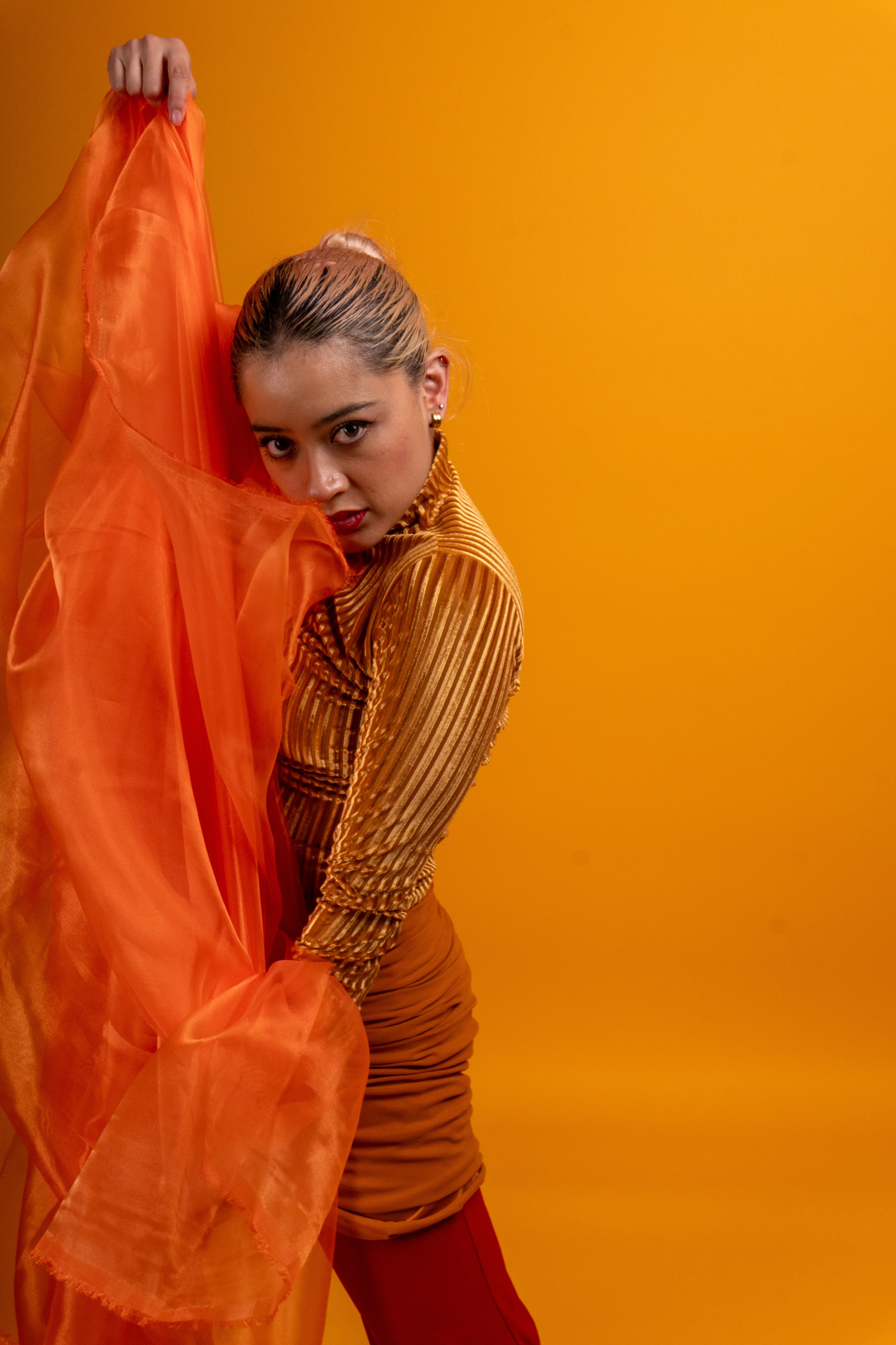 Elegant Contemporary Dancer in Vibrant Orange Attire · Free Stock Photo