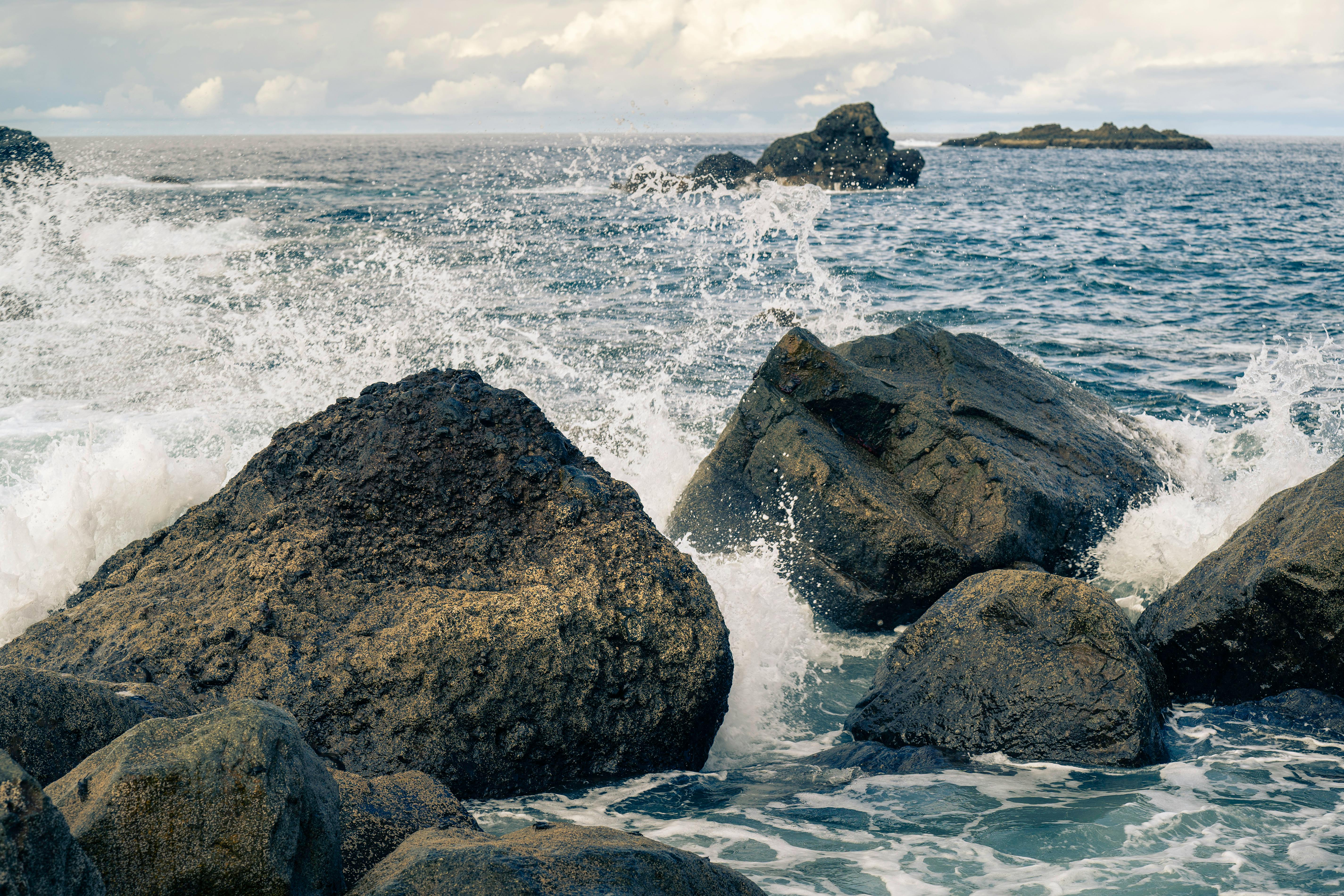 Waves Crashing on Rocky Shoreline at Sea · Free Stock Photo