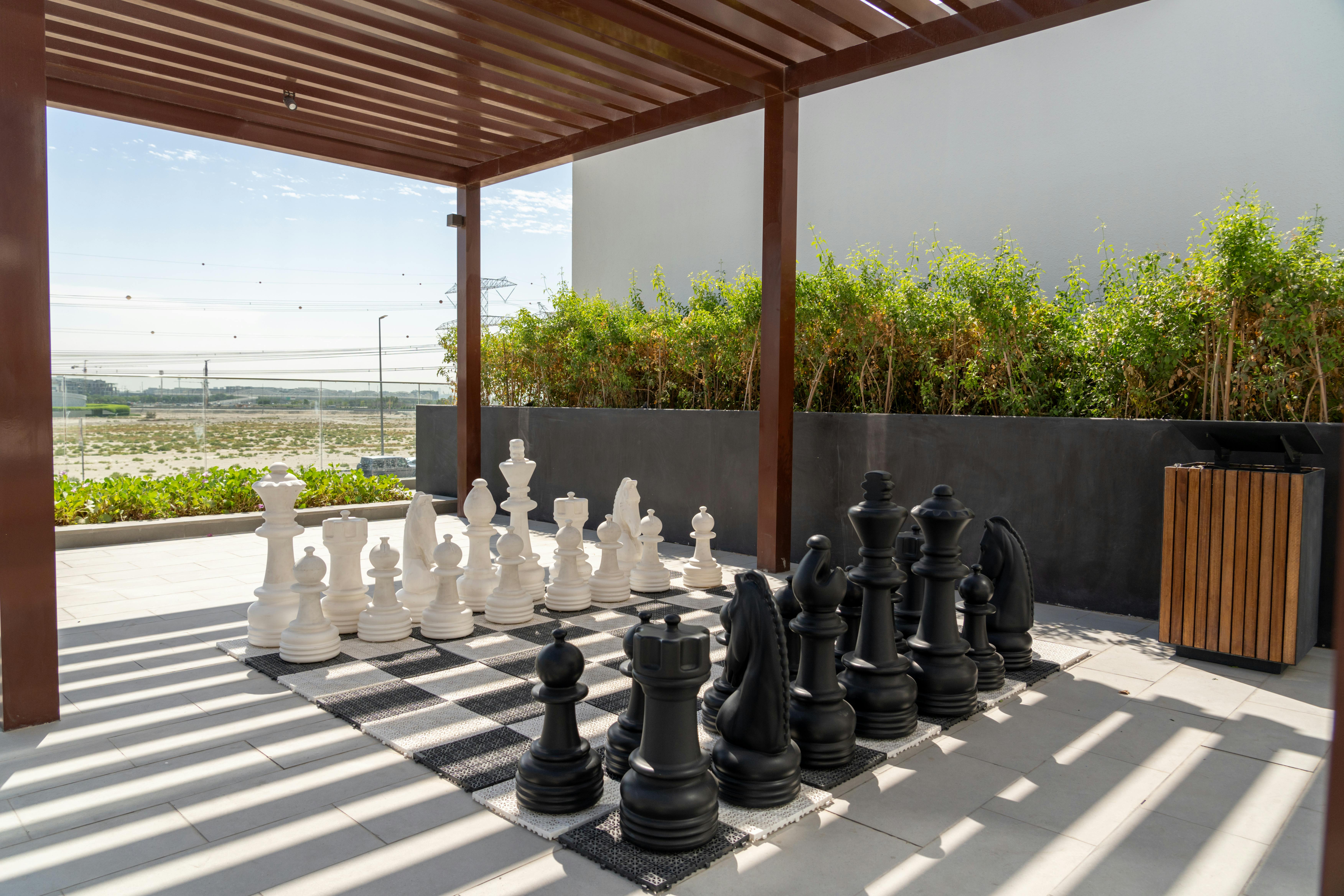 Outdoor Giant Chess Set in Dubai Shade Pavilion · Free Stock Photo