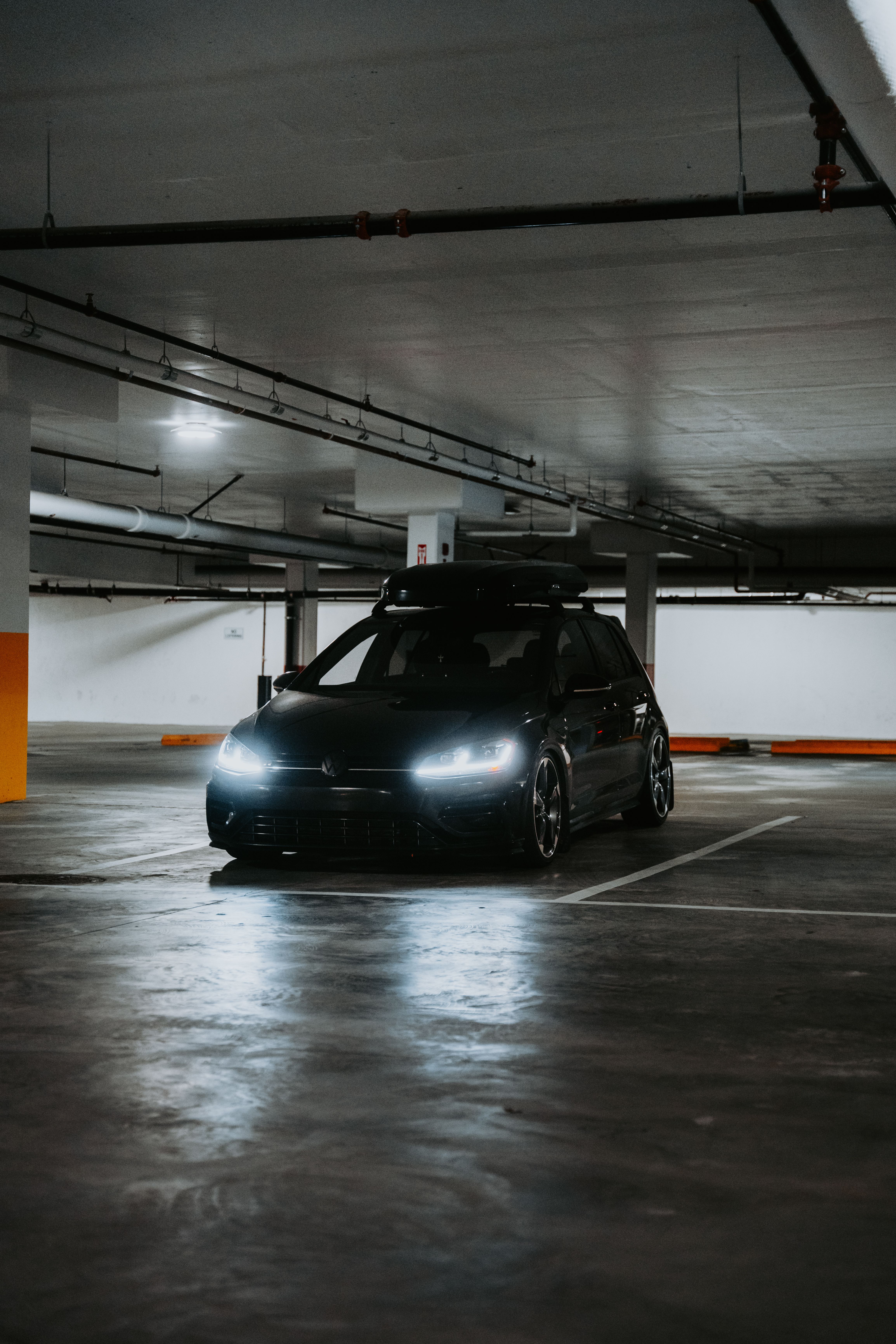Sleek Car in Dimly Lit Parking Garage · Free Stock Photo