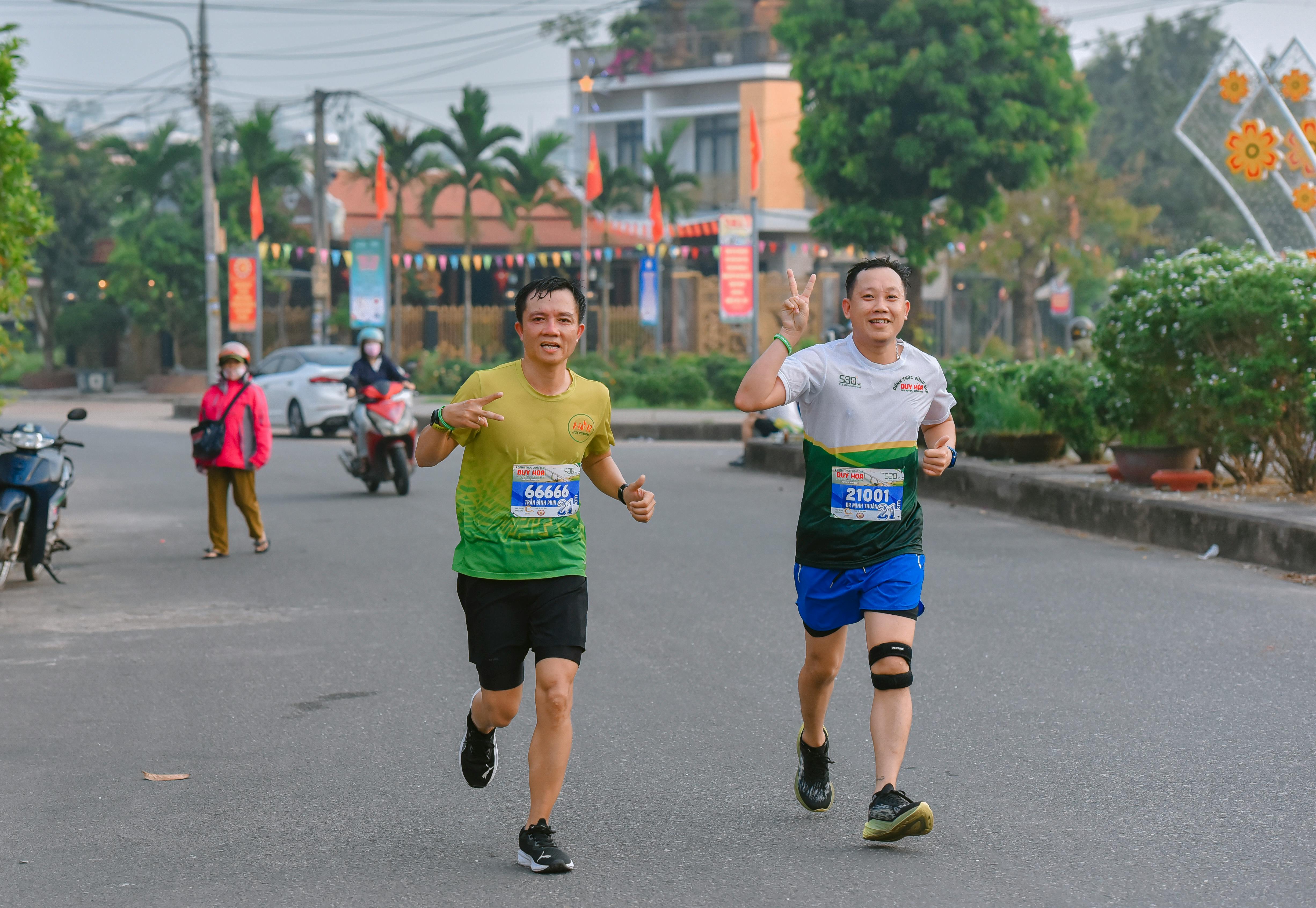 Two Runners Participating in a Outdoor Marathon Event · Free Stock Photo
