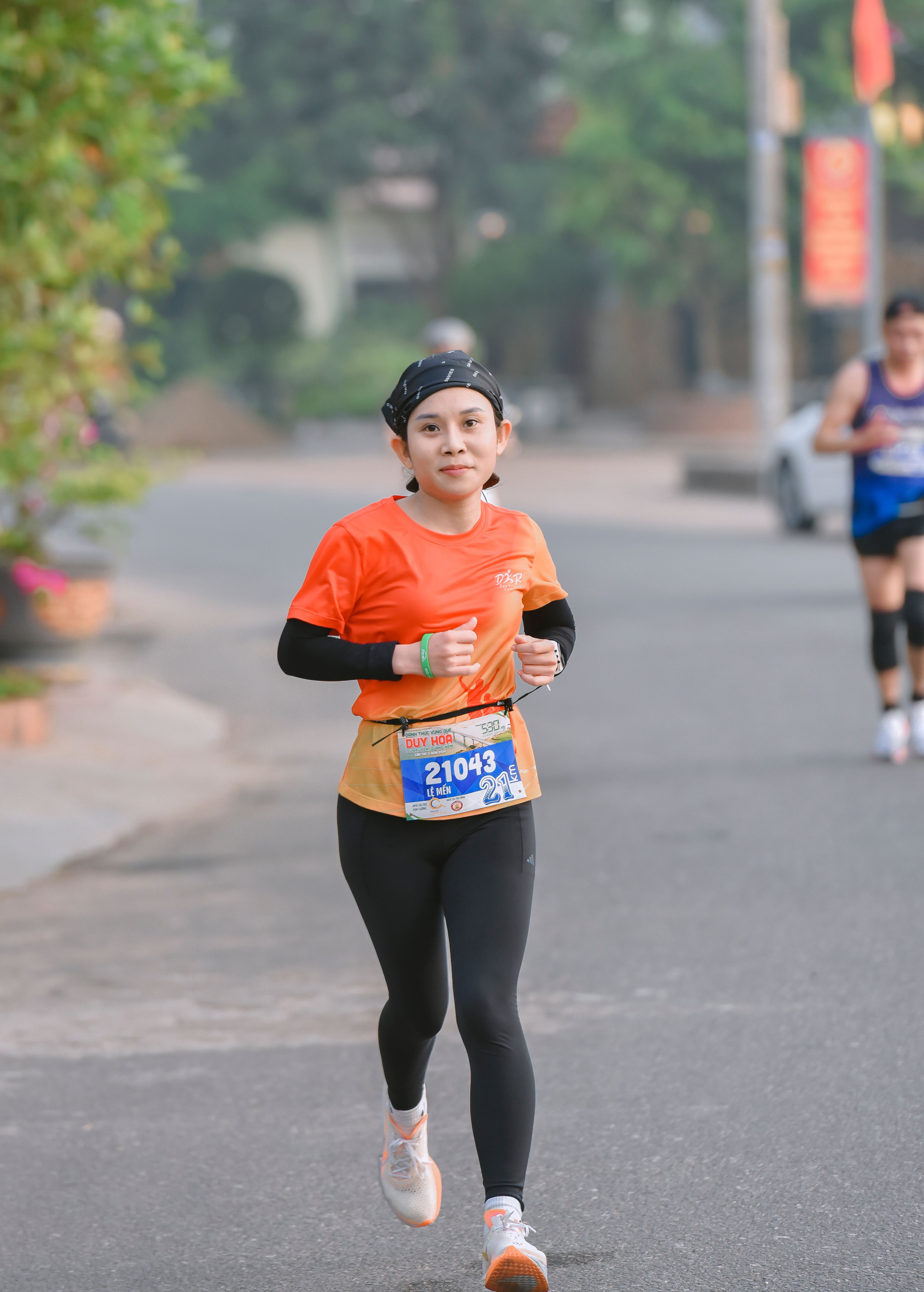 Female Runner Participating in Outdoor Marathon · Free Stock Photo