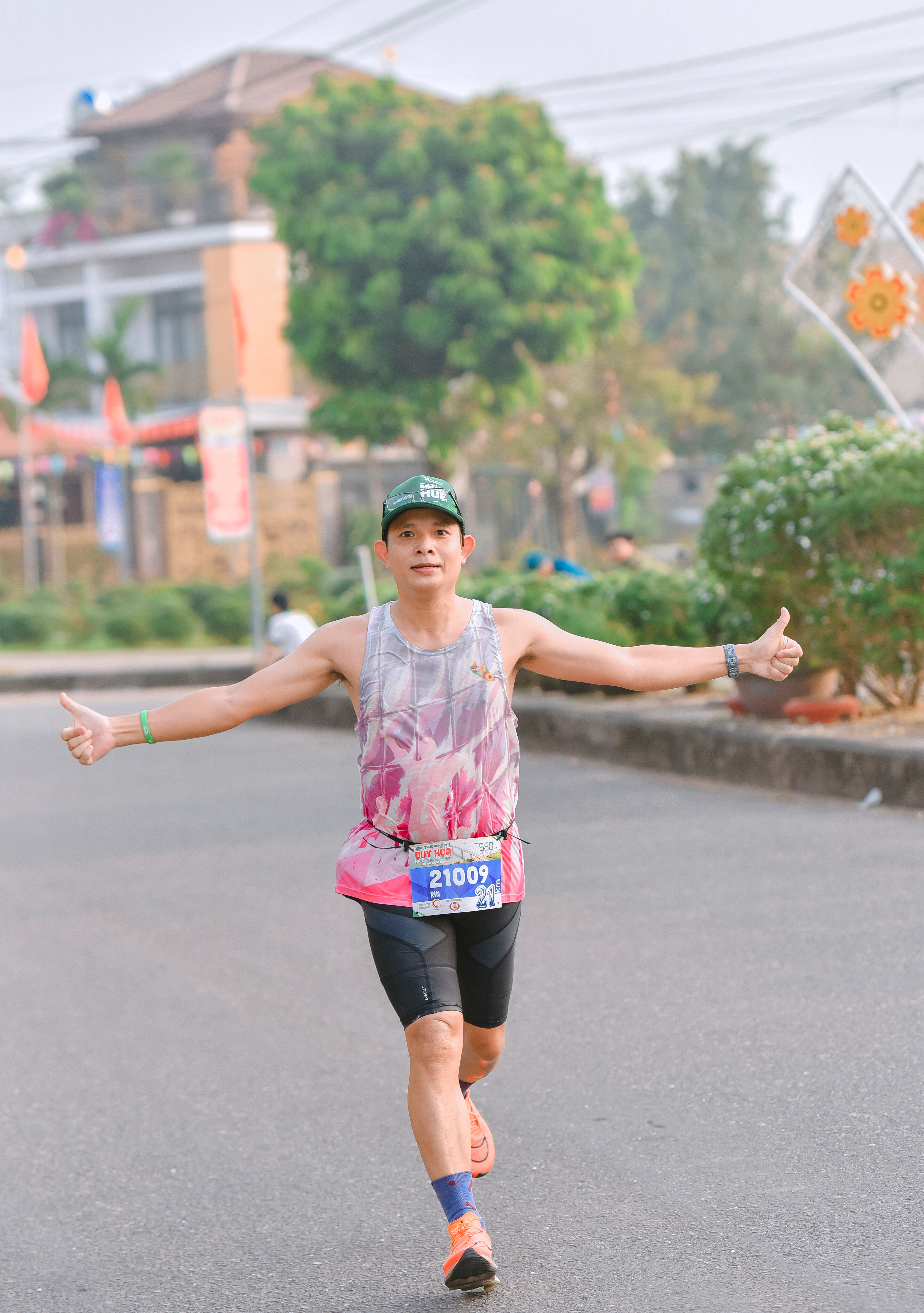 Cheerful Marathon Runner Giving Thumbs Up · Free Stock Photo