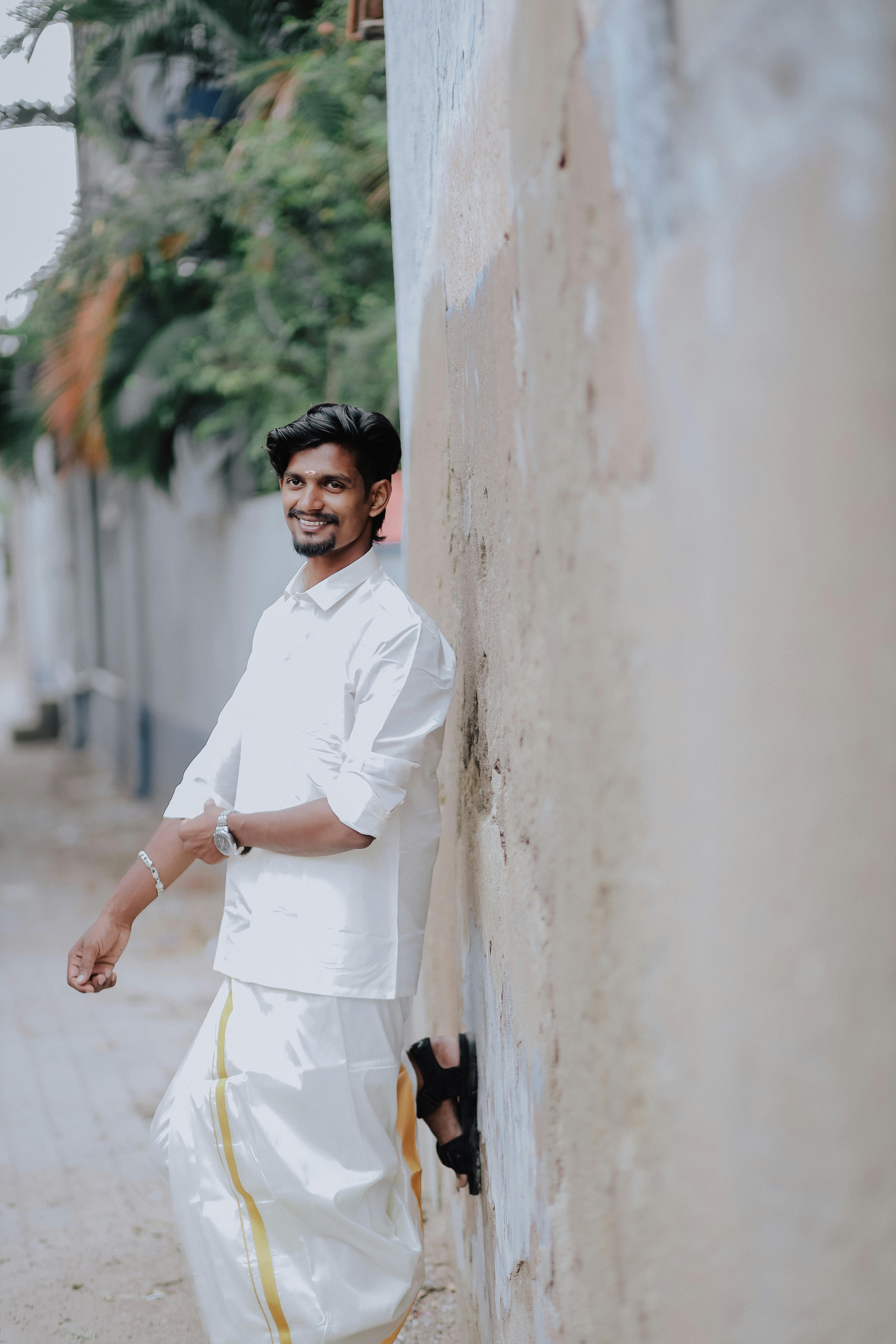 Smiling Indian Man in Traditional Attire Outdoors · Free Stock Photo