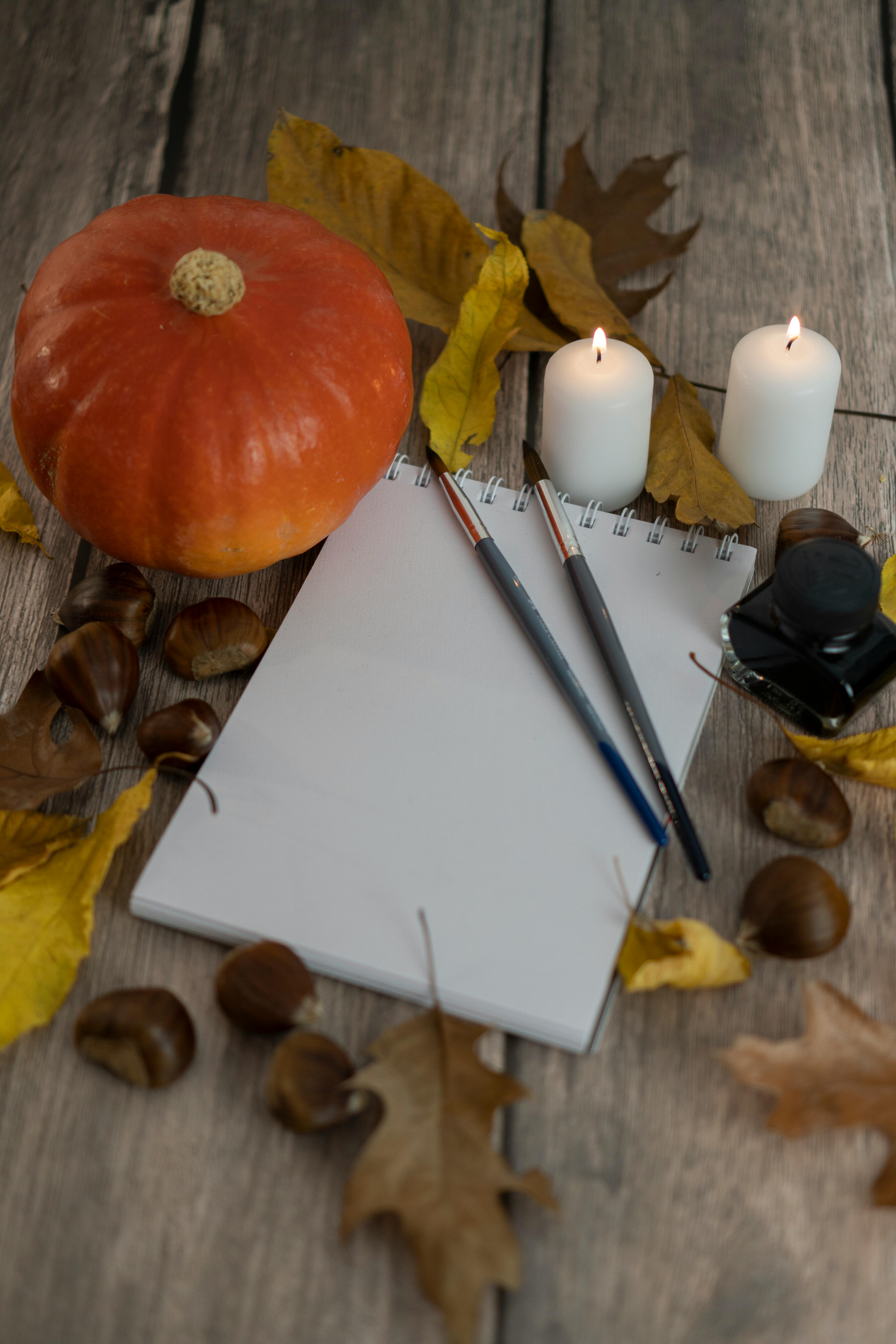 Cozy Autumn Scene with Pumpkins and Candles · Free Stock Photo