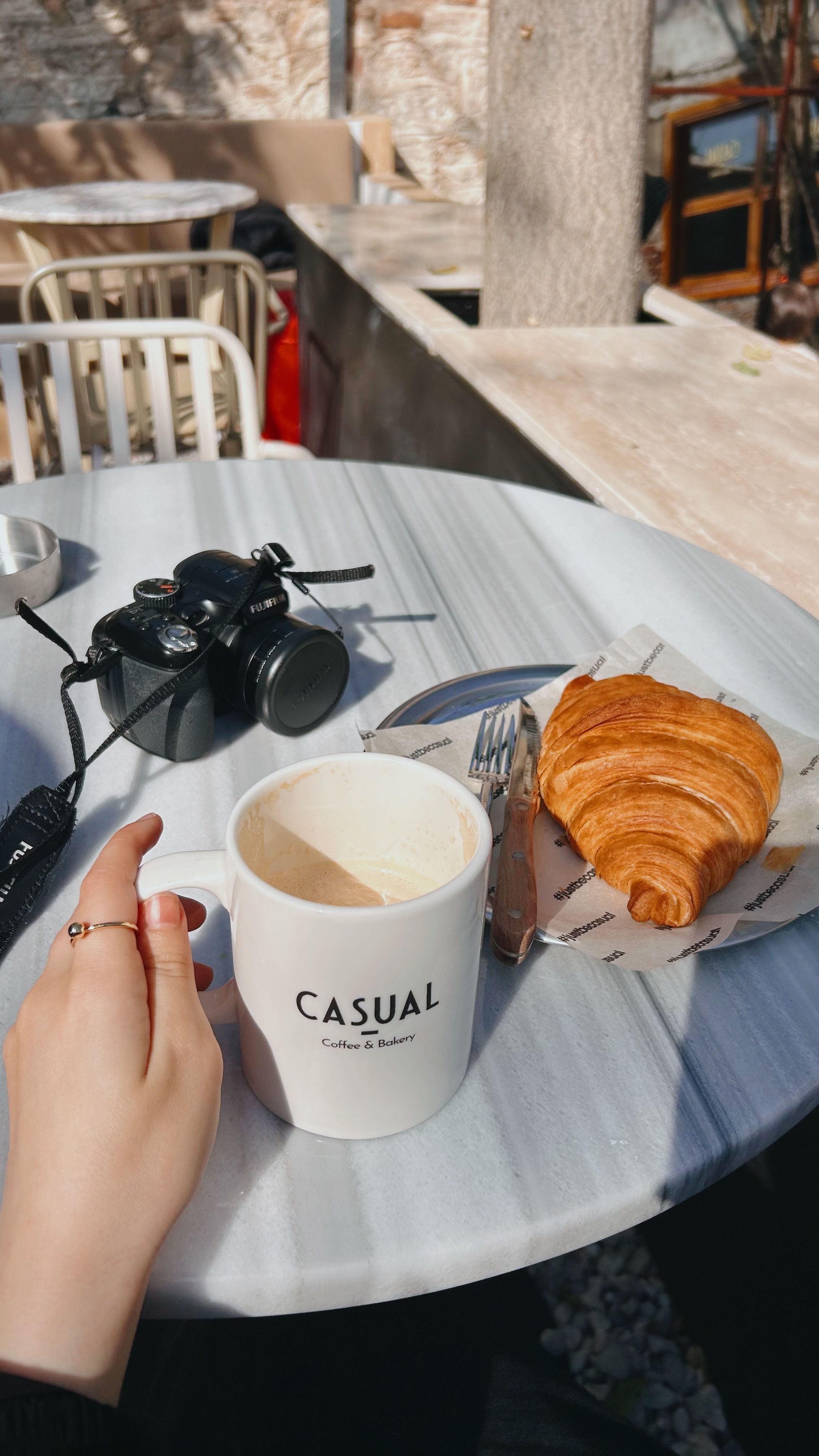 Relaxing Cafe Moment with Coffee and Croissant · Free Stock Photo