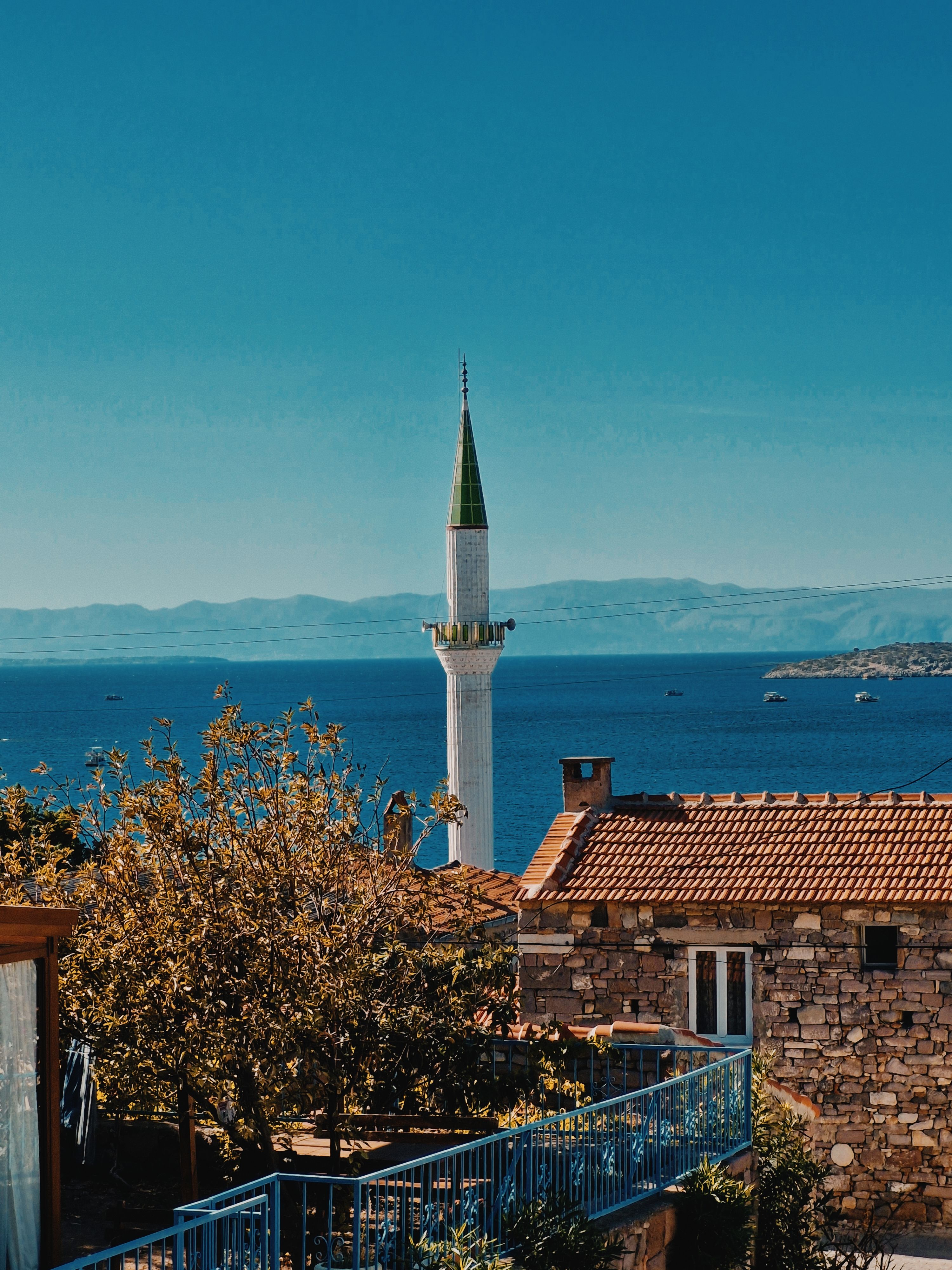 Scenic Coastal View with Mosque Minaret · Free Stock Photo