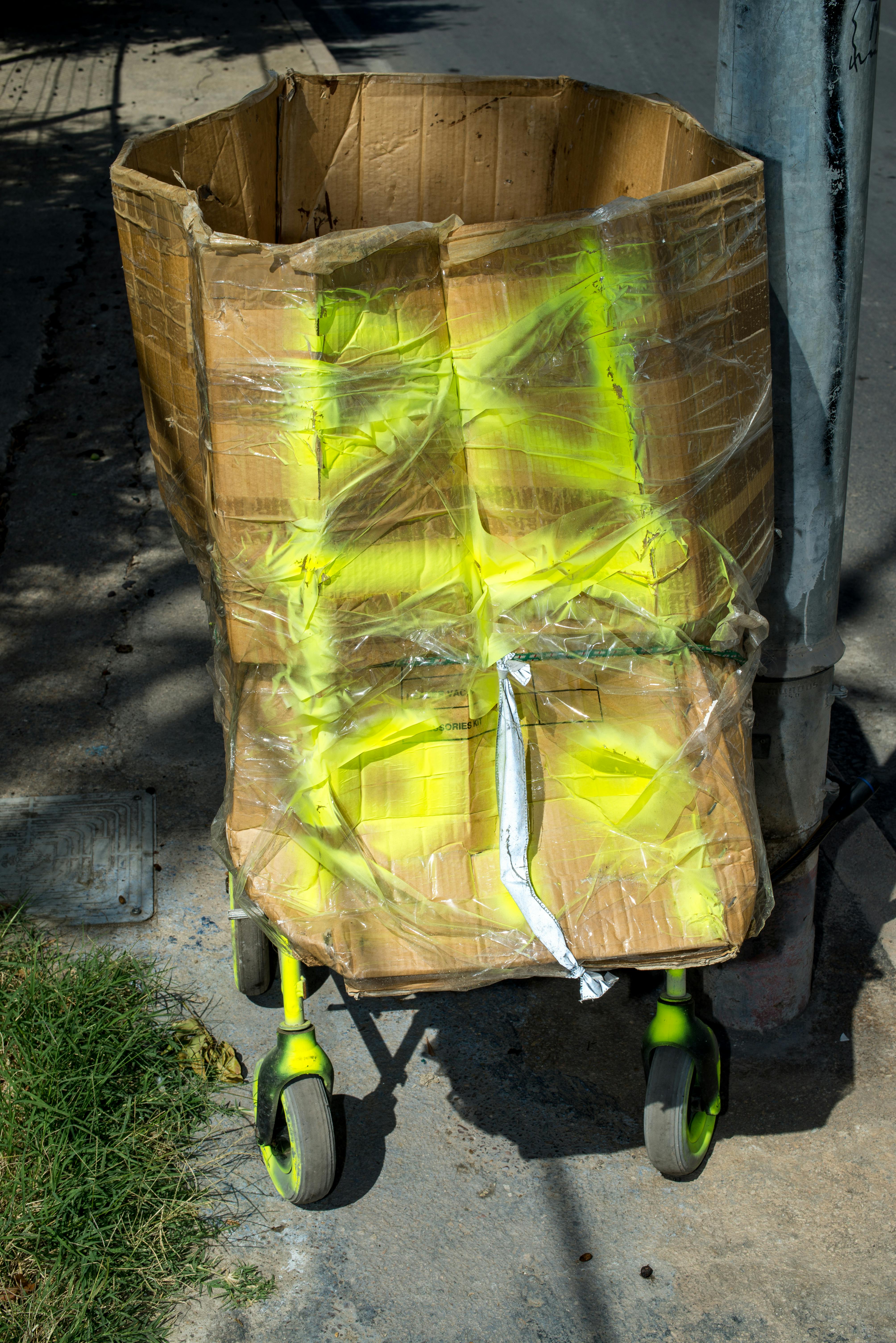 DIY Cardboard Cart with Neon Accents on Wheels · Free Stock Photo
