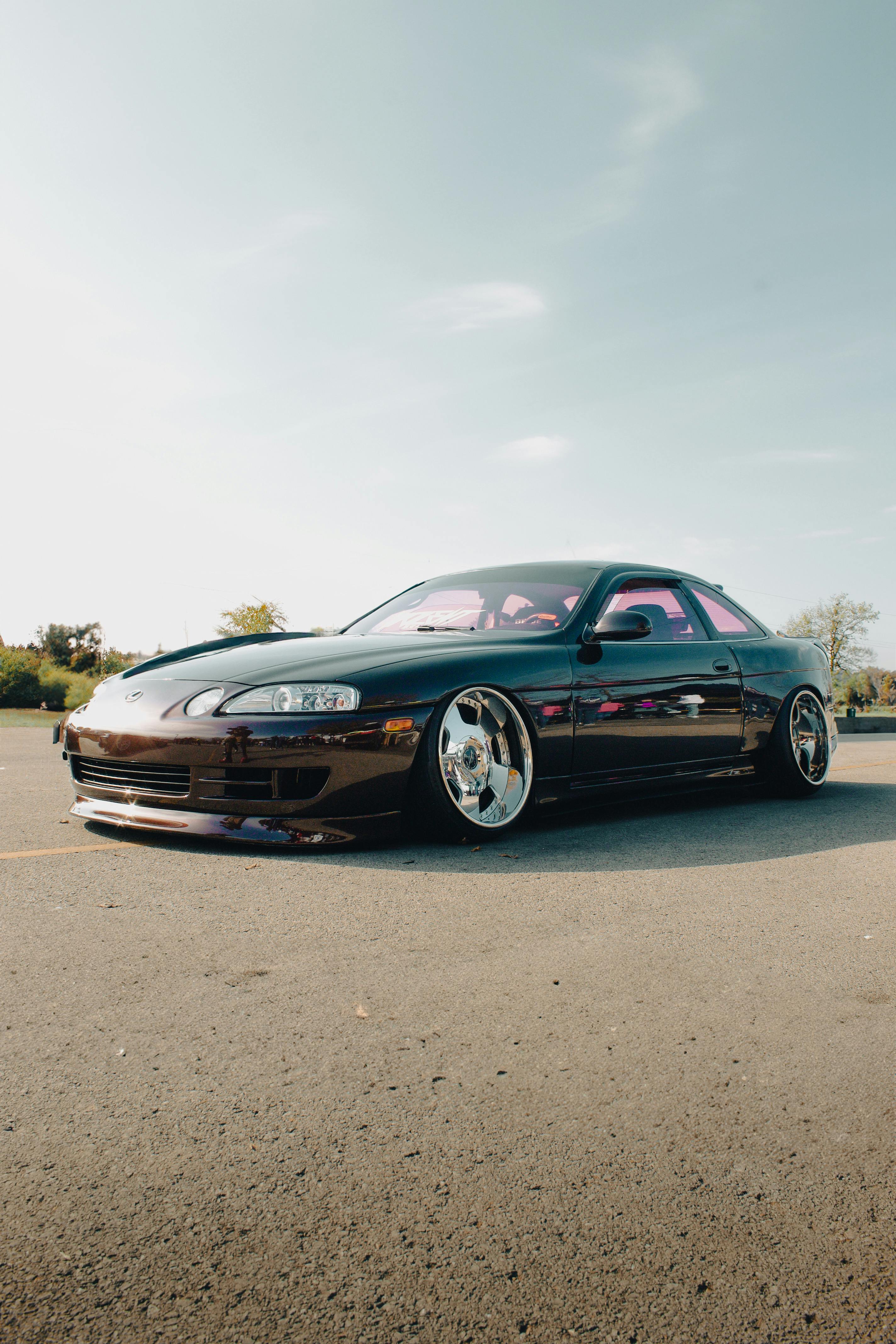 Slammed Stance Car at Outdoor Car Show · Free Stock Photo