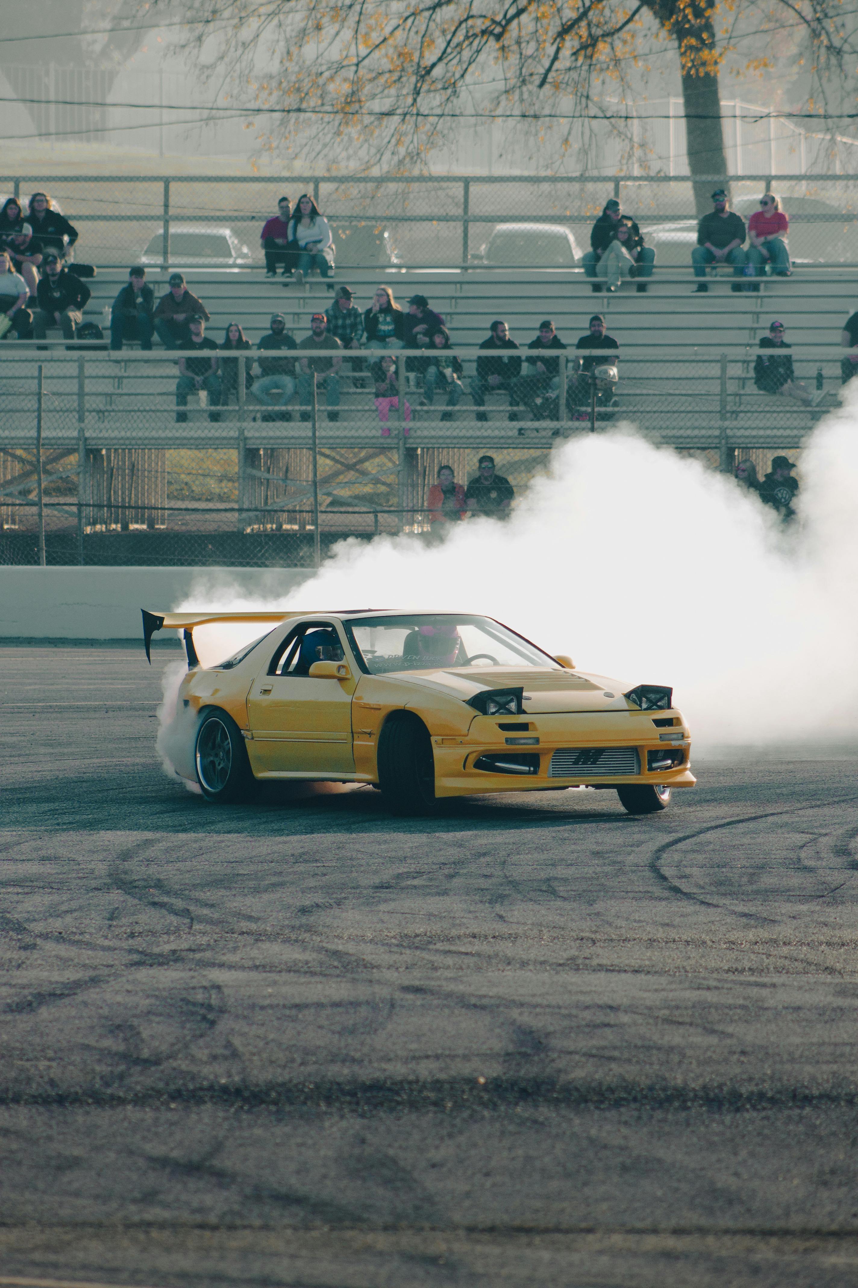 Yellow Mazda RX-7 Drifting at Car Event · Free Stock Photo