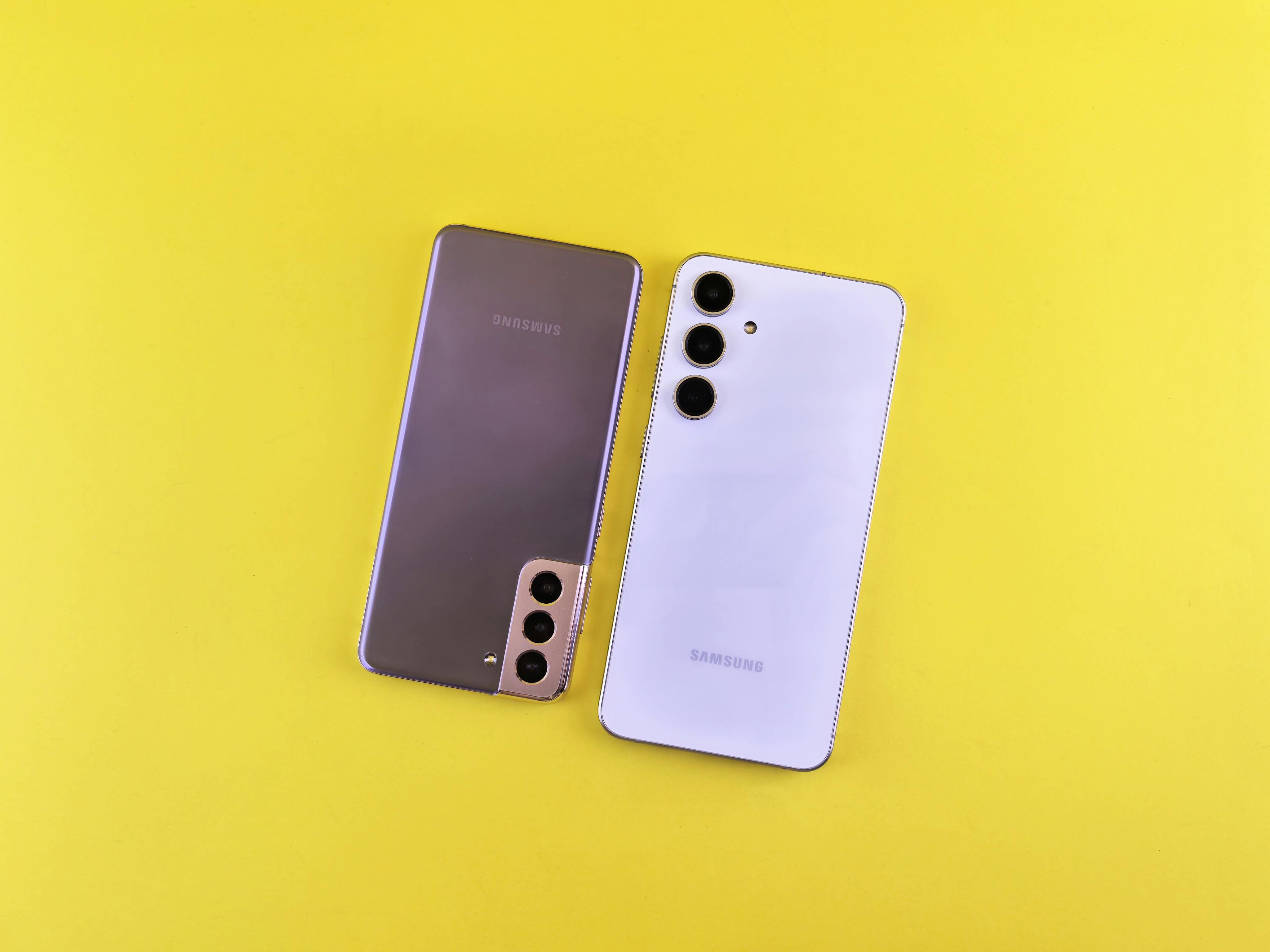 Modern smartphones on vibrant yellow background · Free Stock Photo