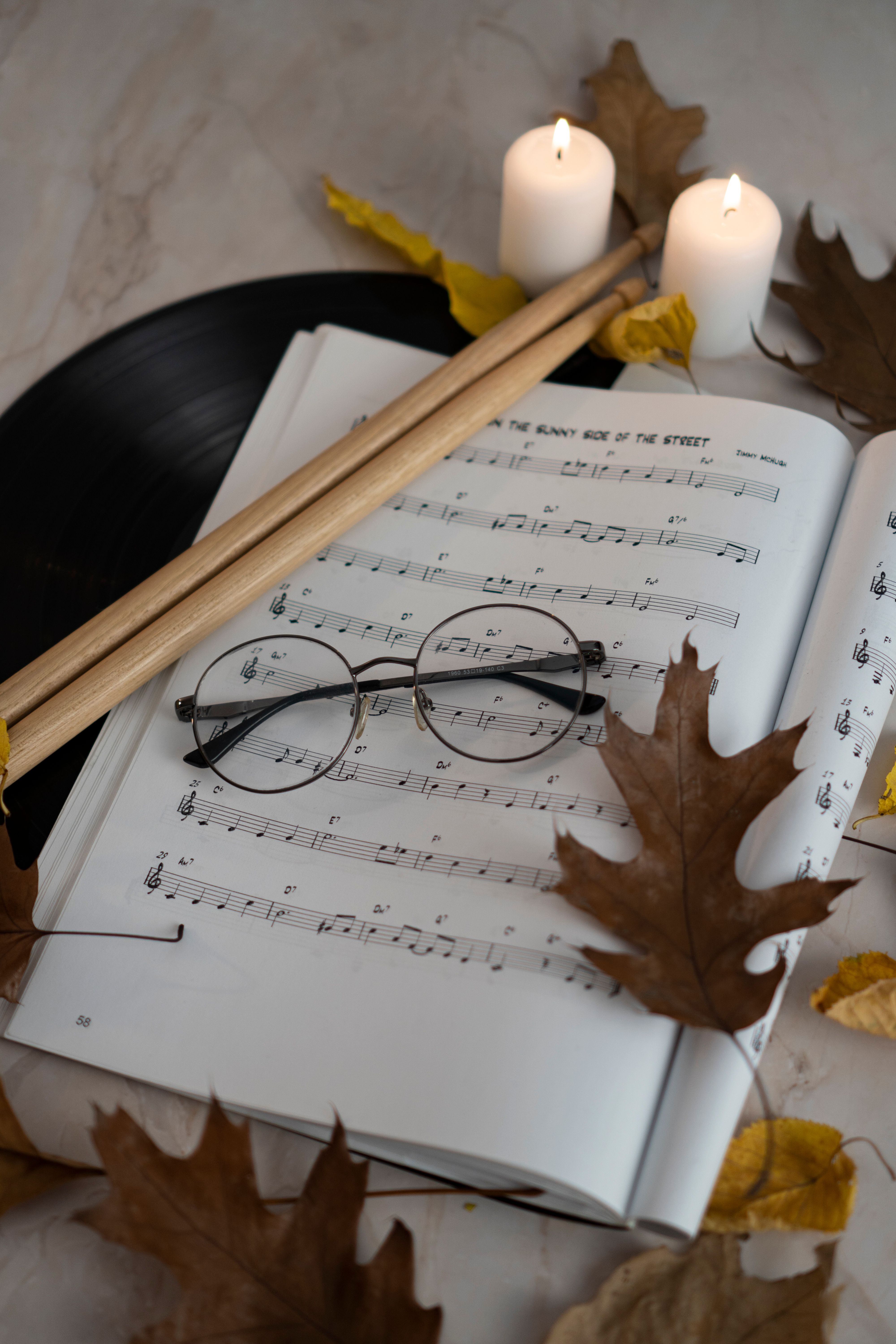 Autumn Still Life with Music Sheet and Vinyl Record · Free Stock Photo