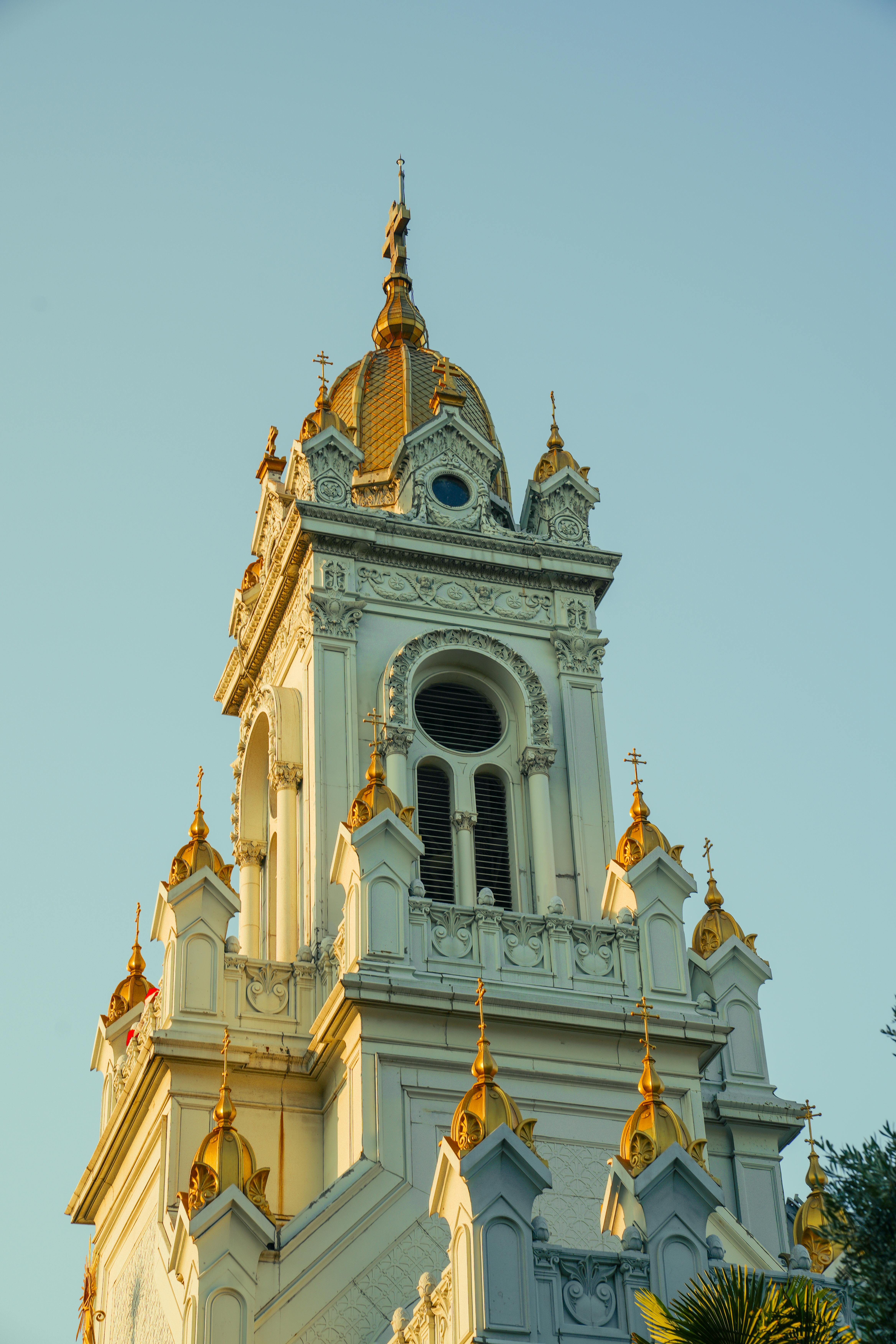 Majestic White Church Tower with Golden Accents · Free Stock Photo