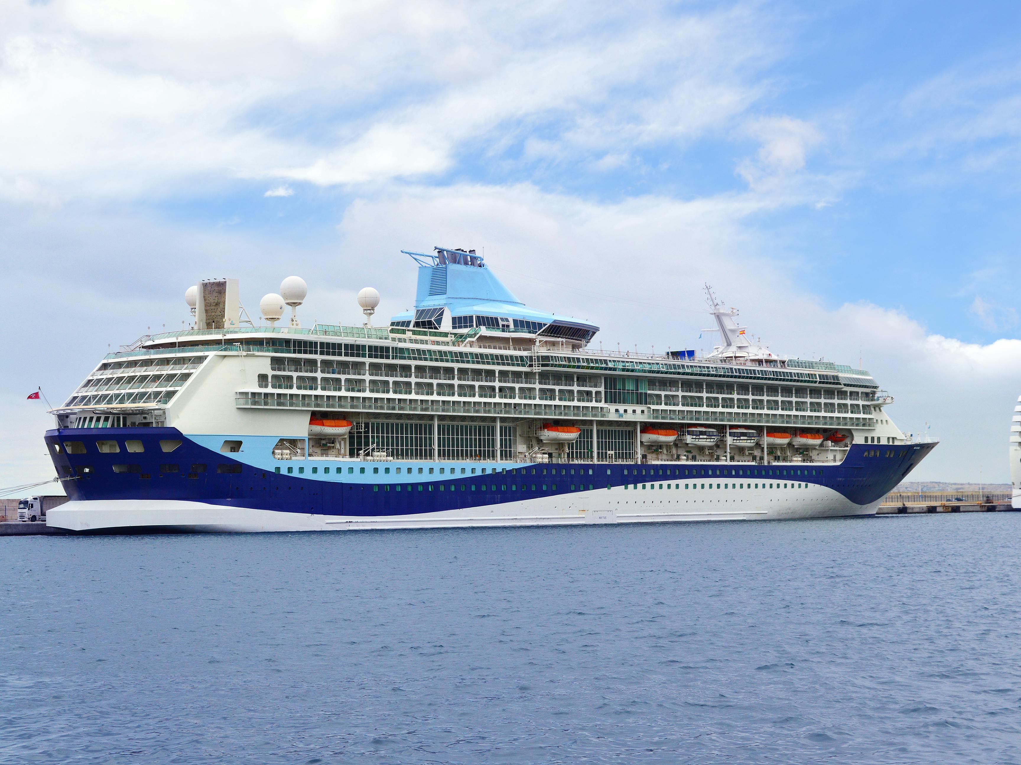 Elegant Cruise Ship Moored Under Blue Skies · Free Stock Photo