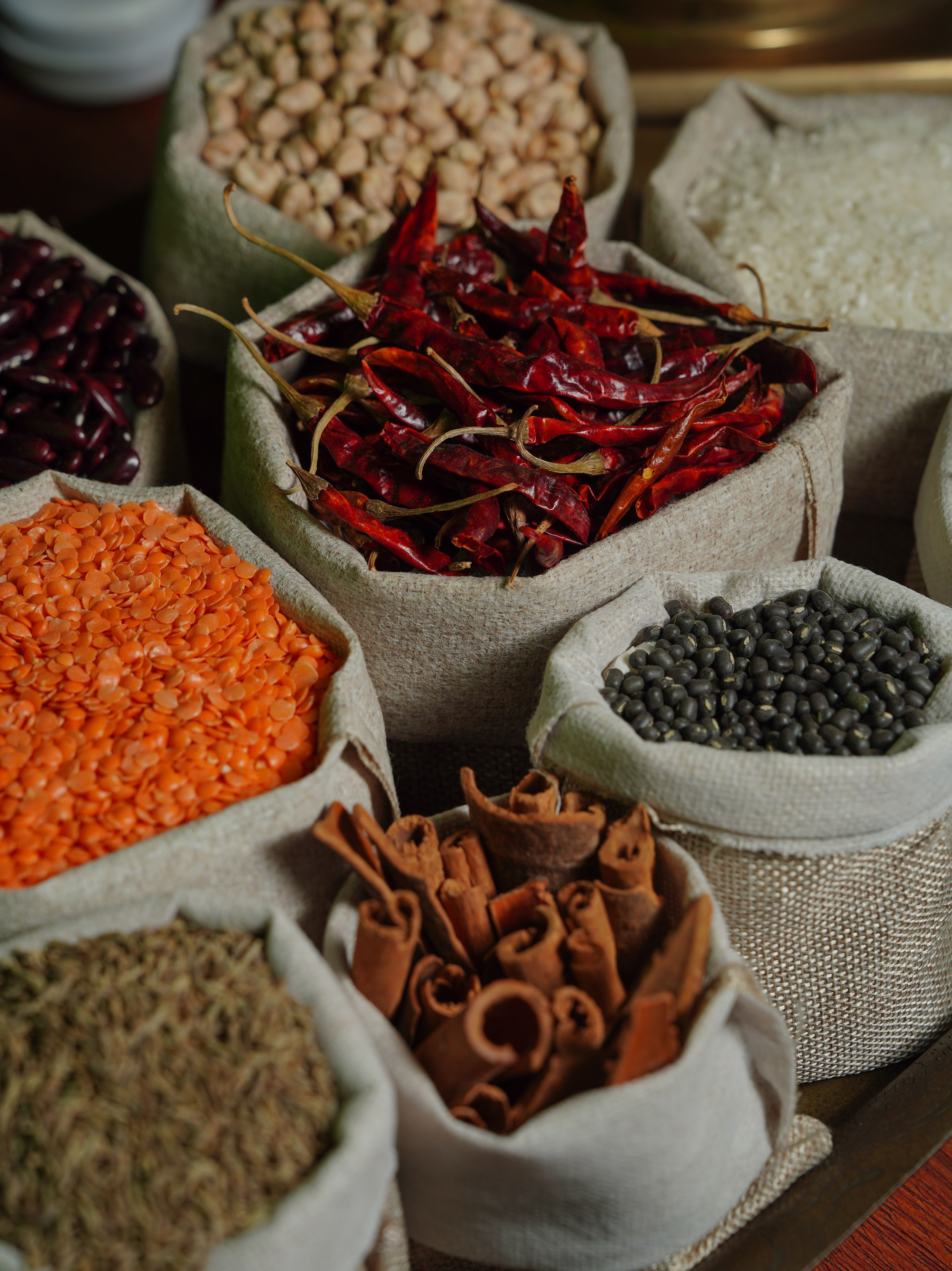 Variety of Spices and Grains in Burlap Bags · Free Stock Photo