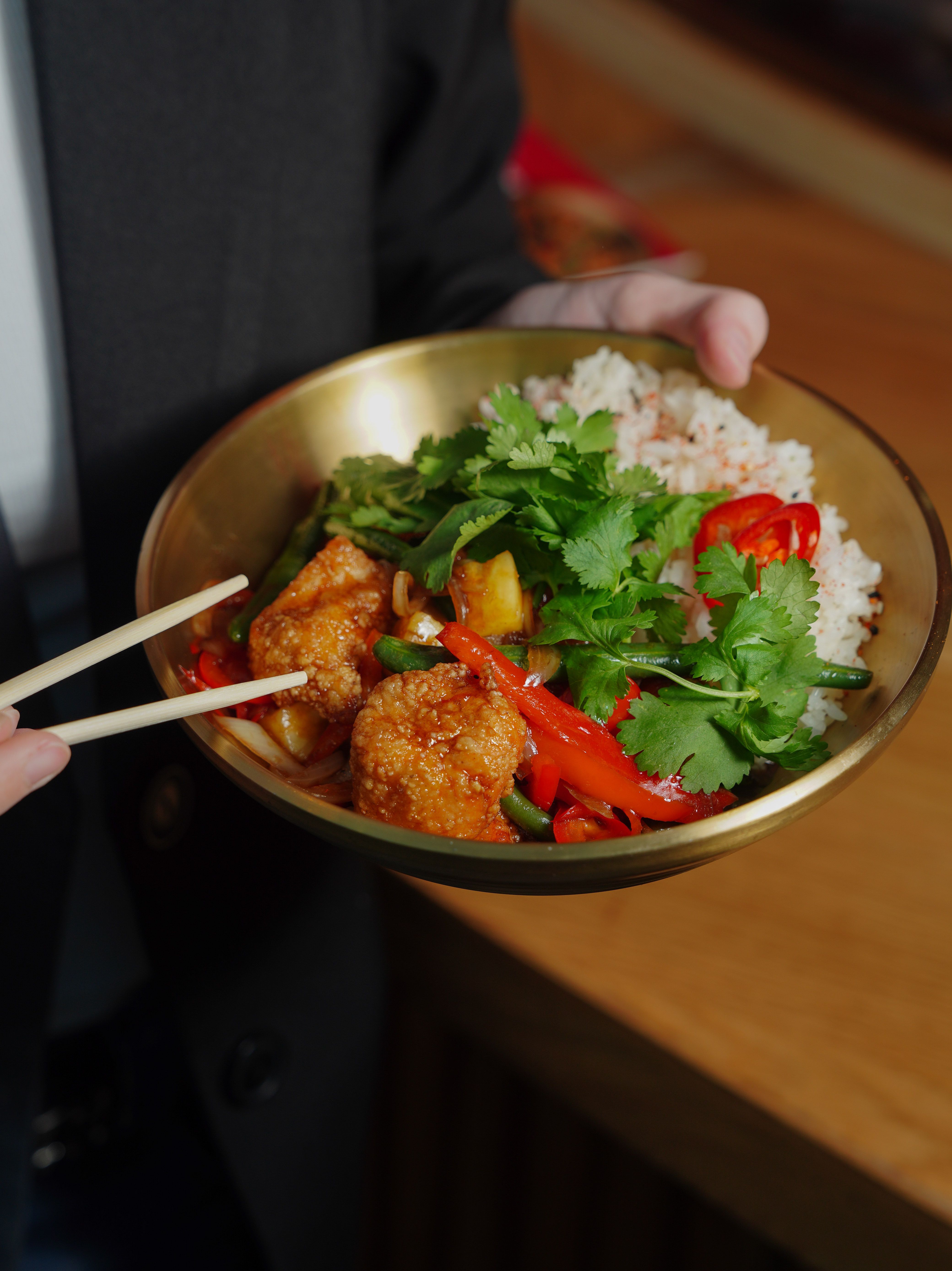 Delicious Asian Cuisine Bowl with Chopsticks · Free Stock Photo