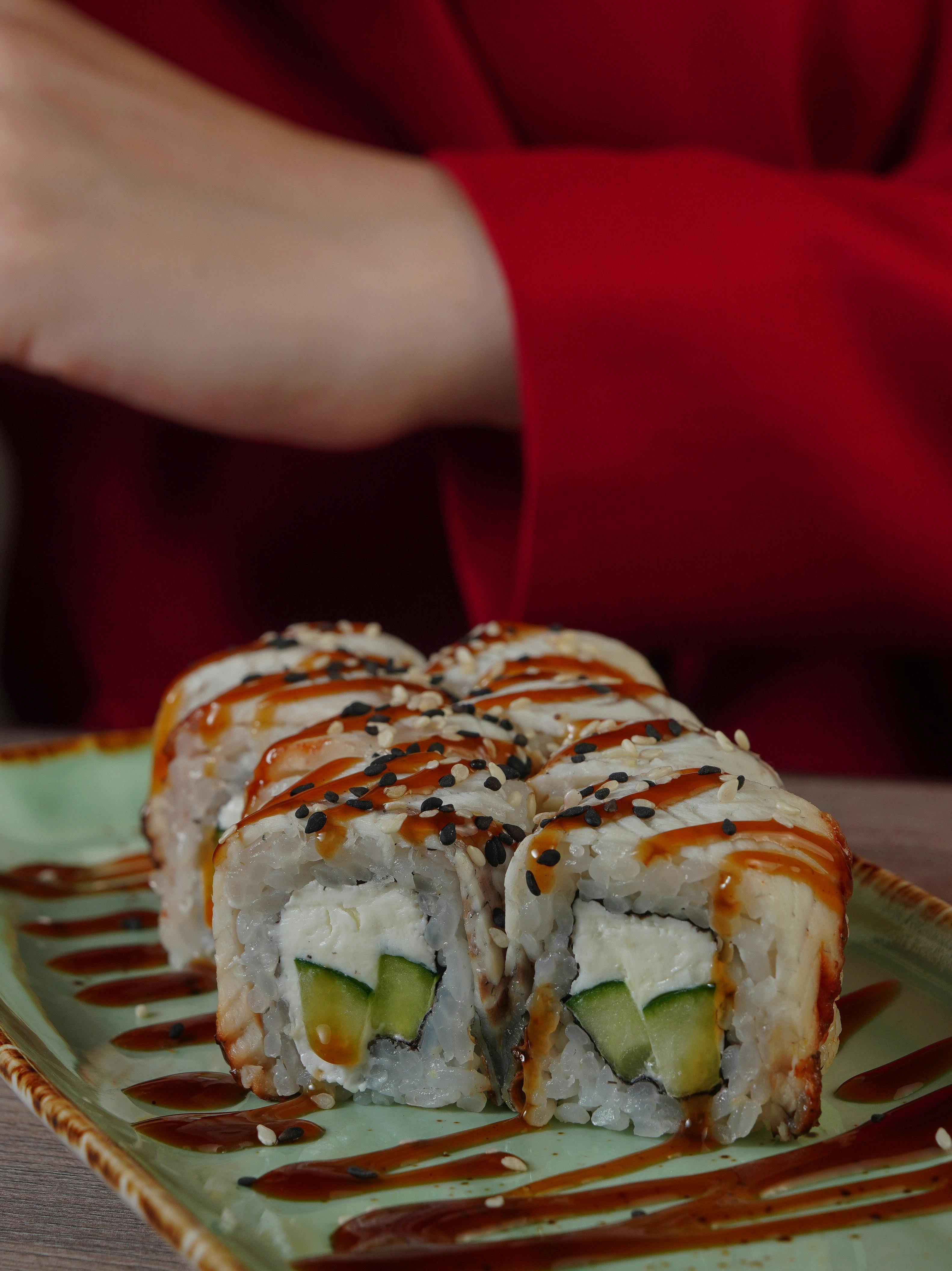 A Chef Using a Blow Torch on Sushi Rolls · Free Stock Photo
