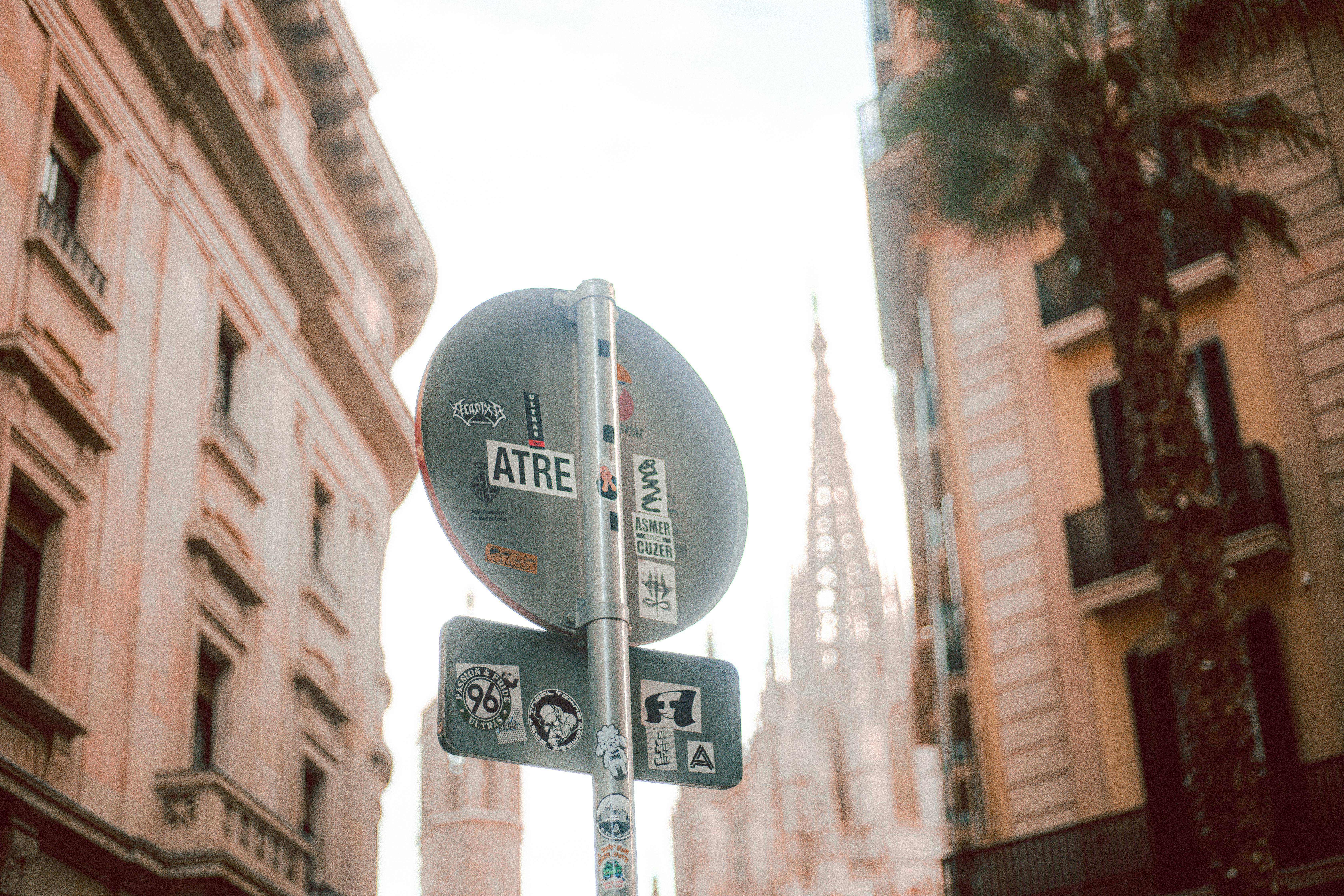 Urban Street Sign with Stickers in Barcelona · Free Stock Photo