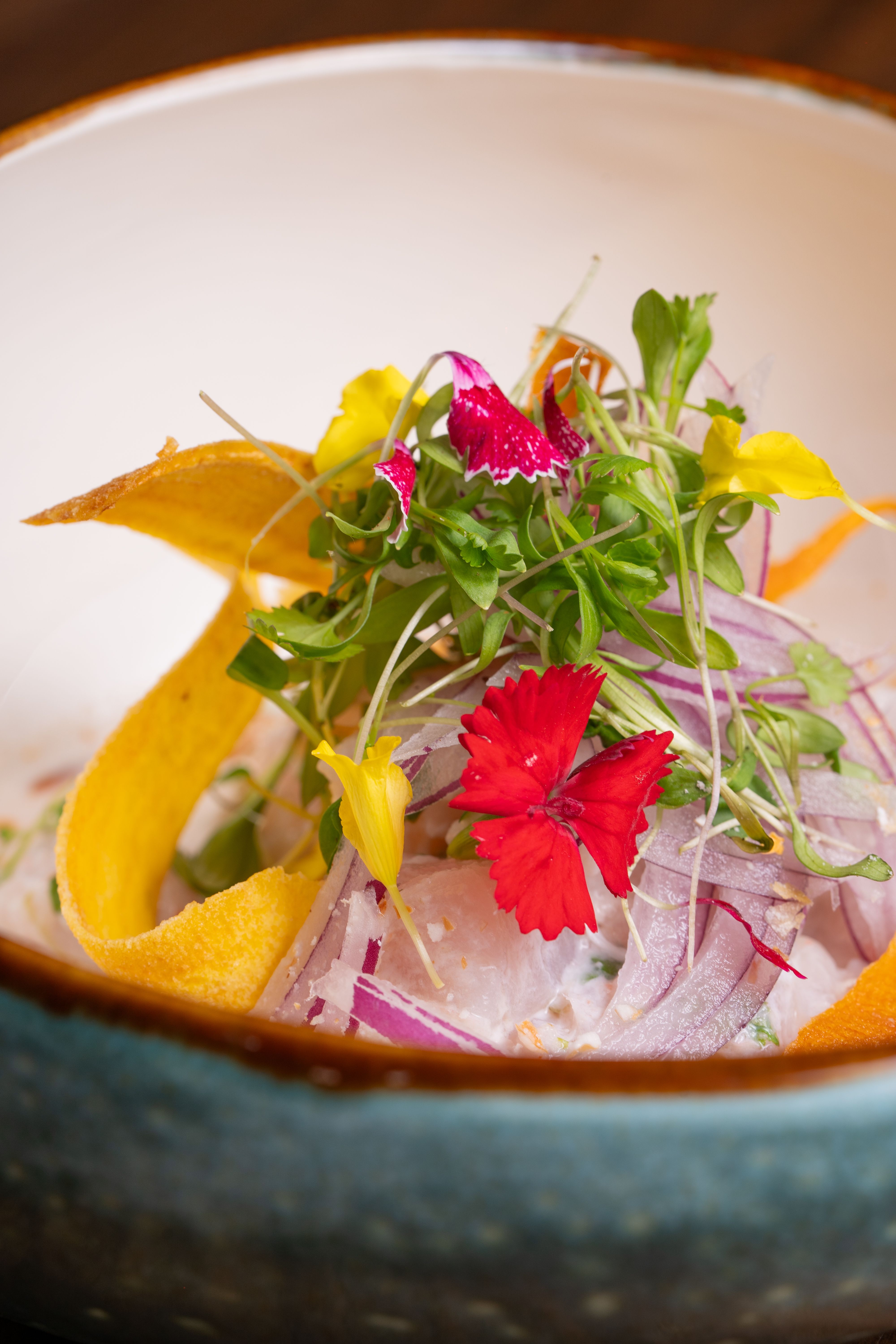 Elegant Culinary Dish with Edible Flowers · Free Stock Photo