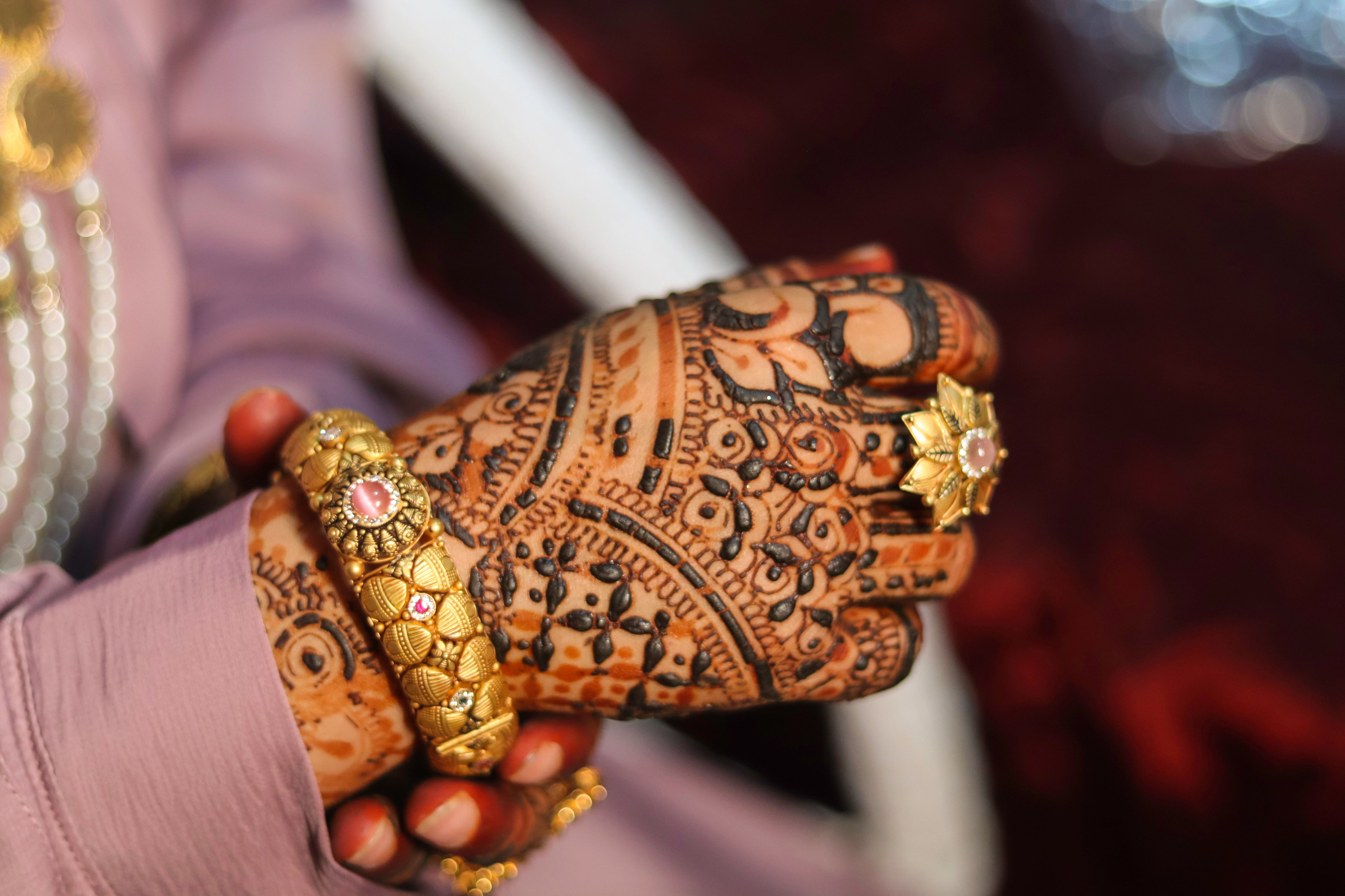 Intricate Henna Design on Bride's Hand with Jewelry · Free Stock Photo