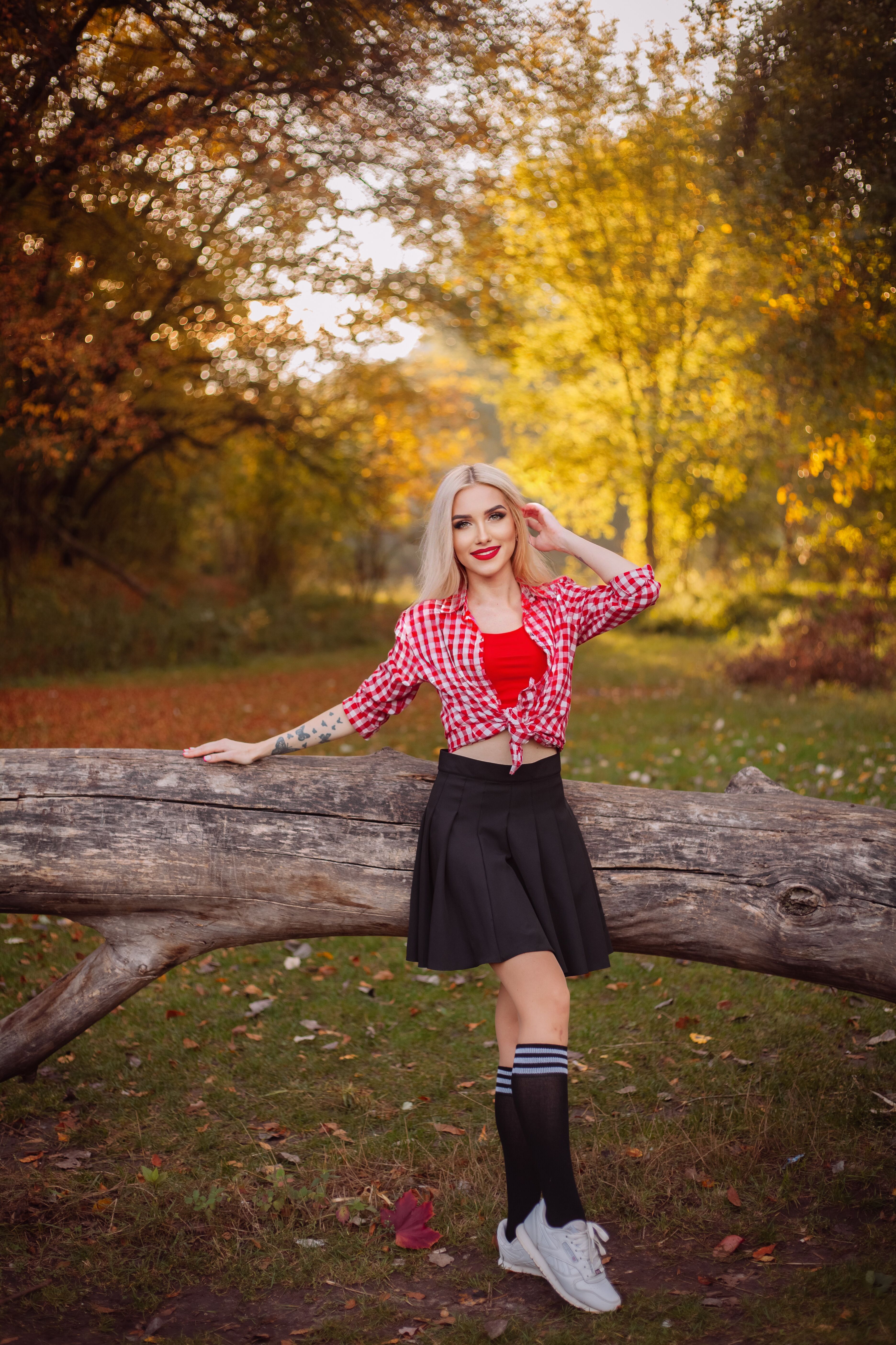 Woman in Autumn Forest Wearing Checkered Shirt · Free Stock Photo