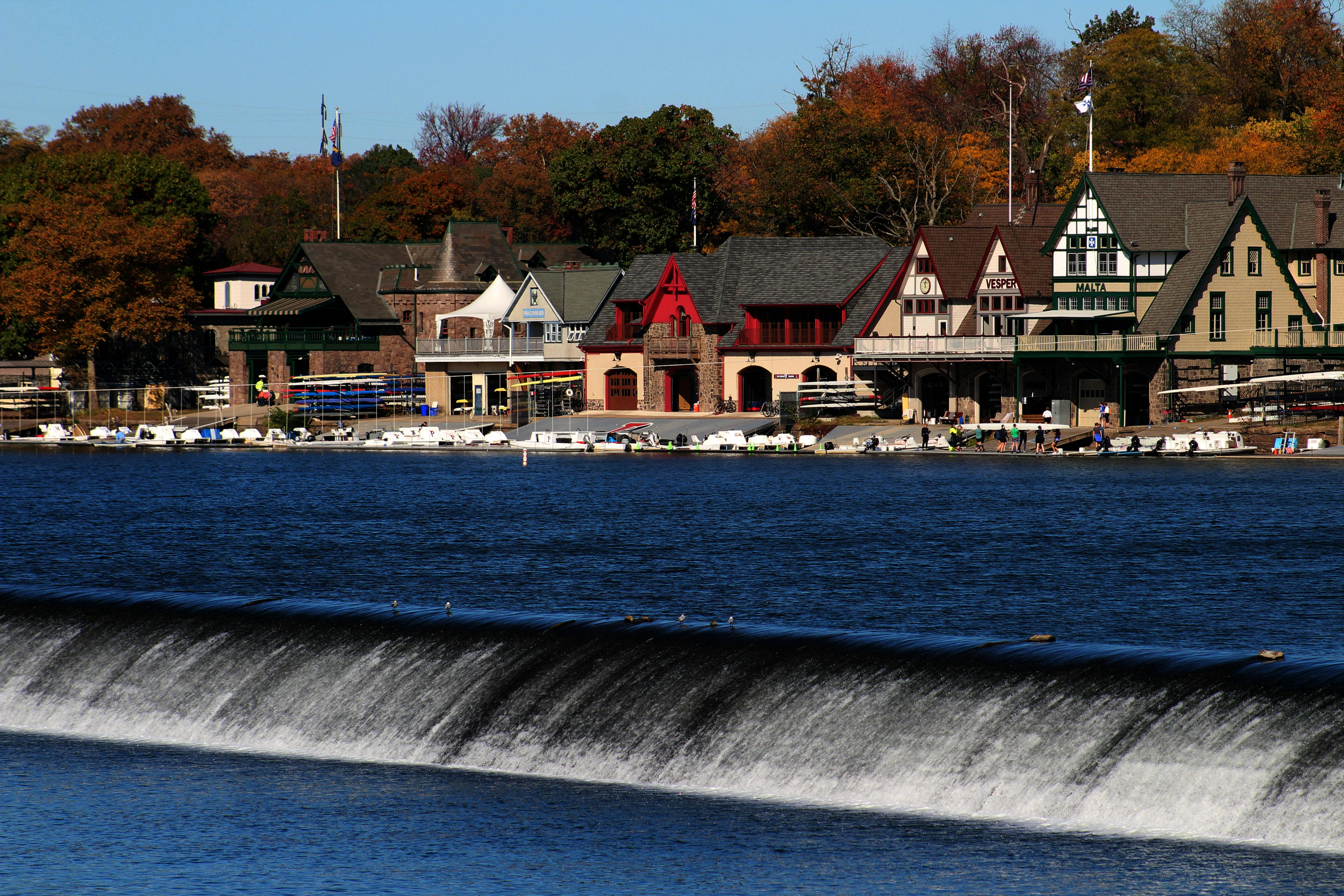 Historic Boathouse Row by River in Fall · Free Stock Photo