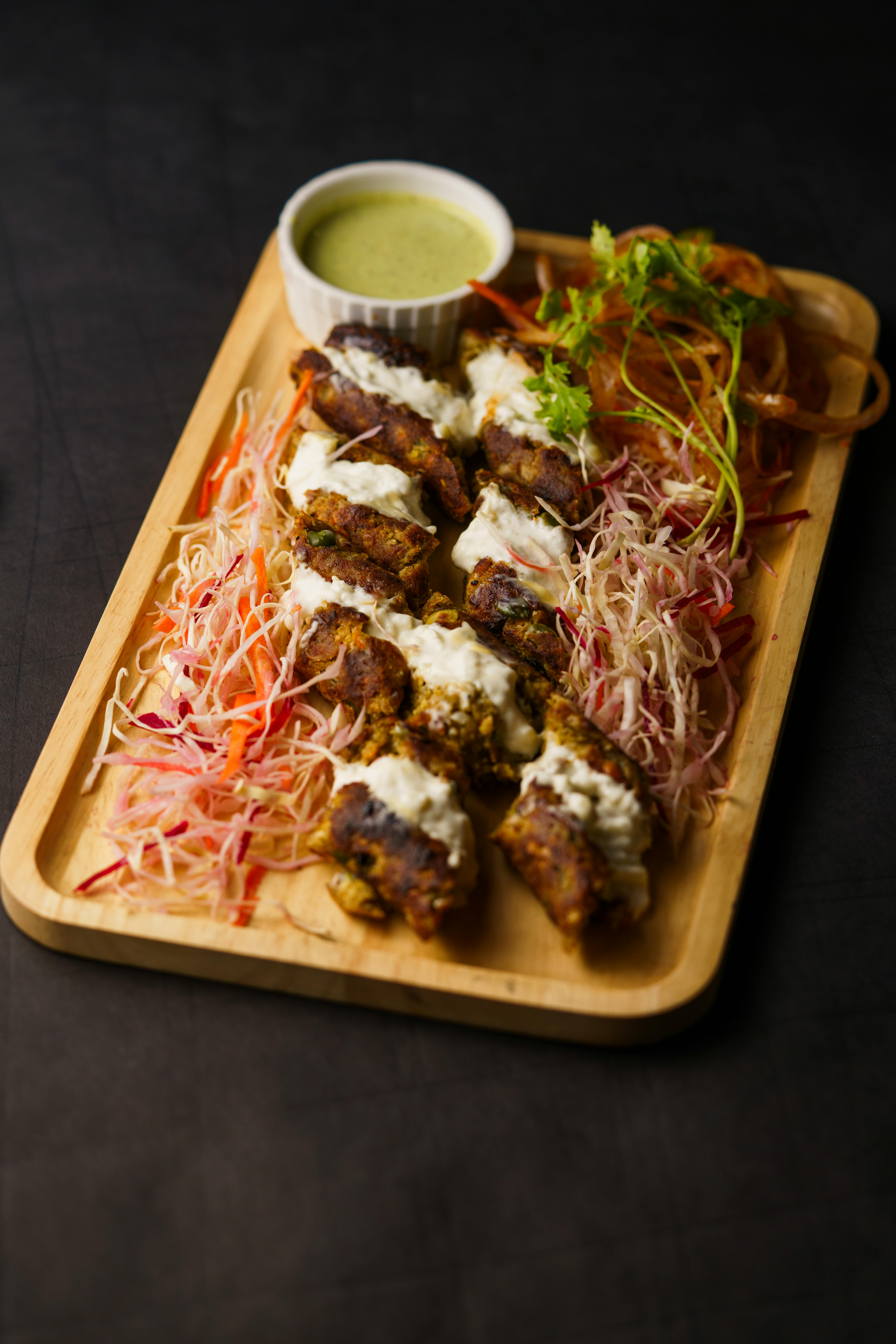 Gourmet Grilled Chicken Platter with Sauce · Free Stock Photo