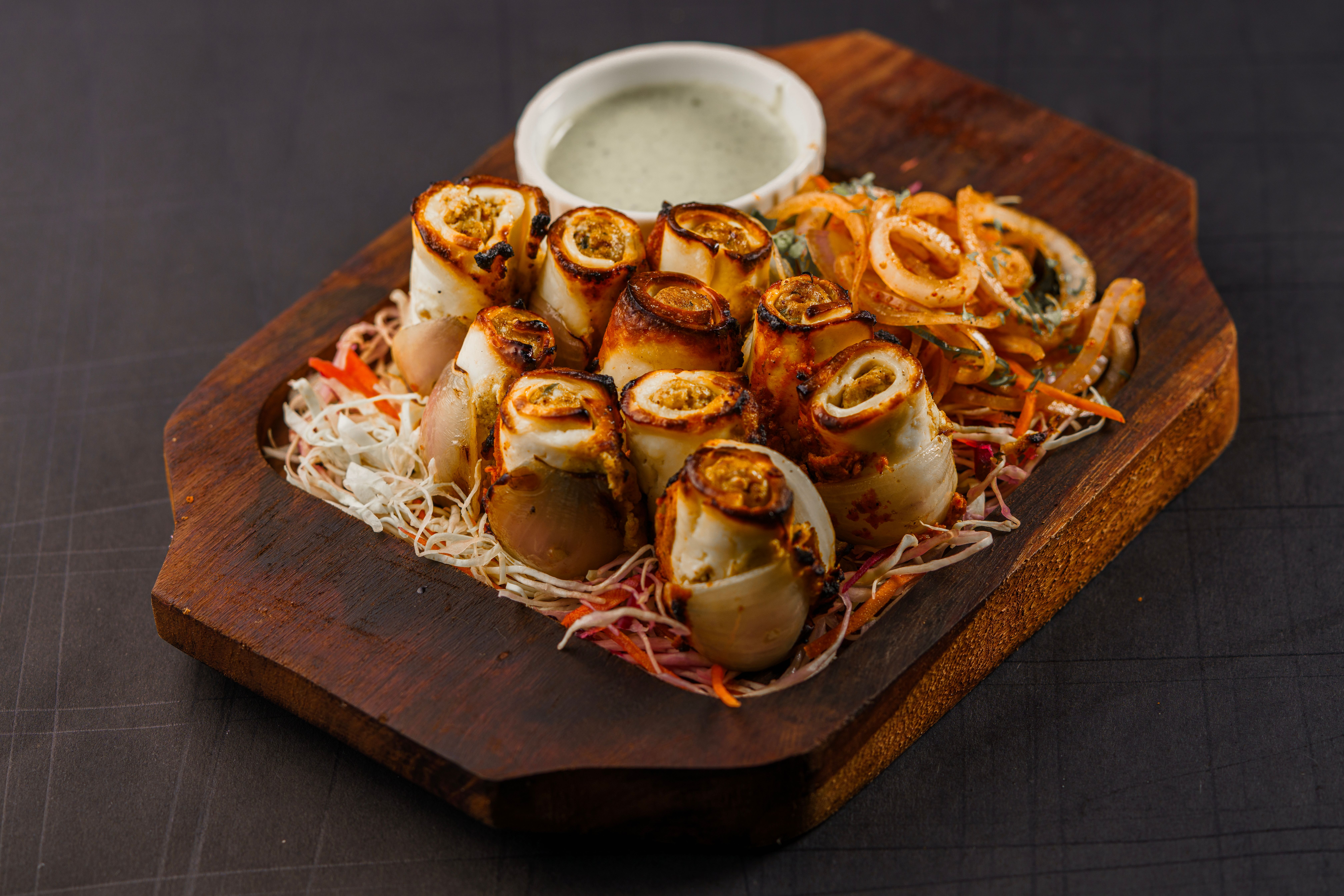 Grilled Paneer Rolls on Rustic Wooden Platter · Free Stock Photo