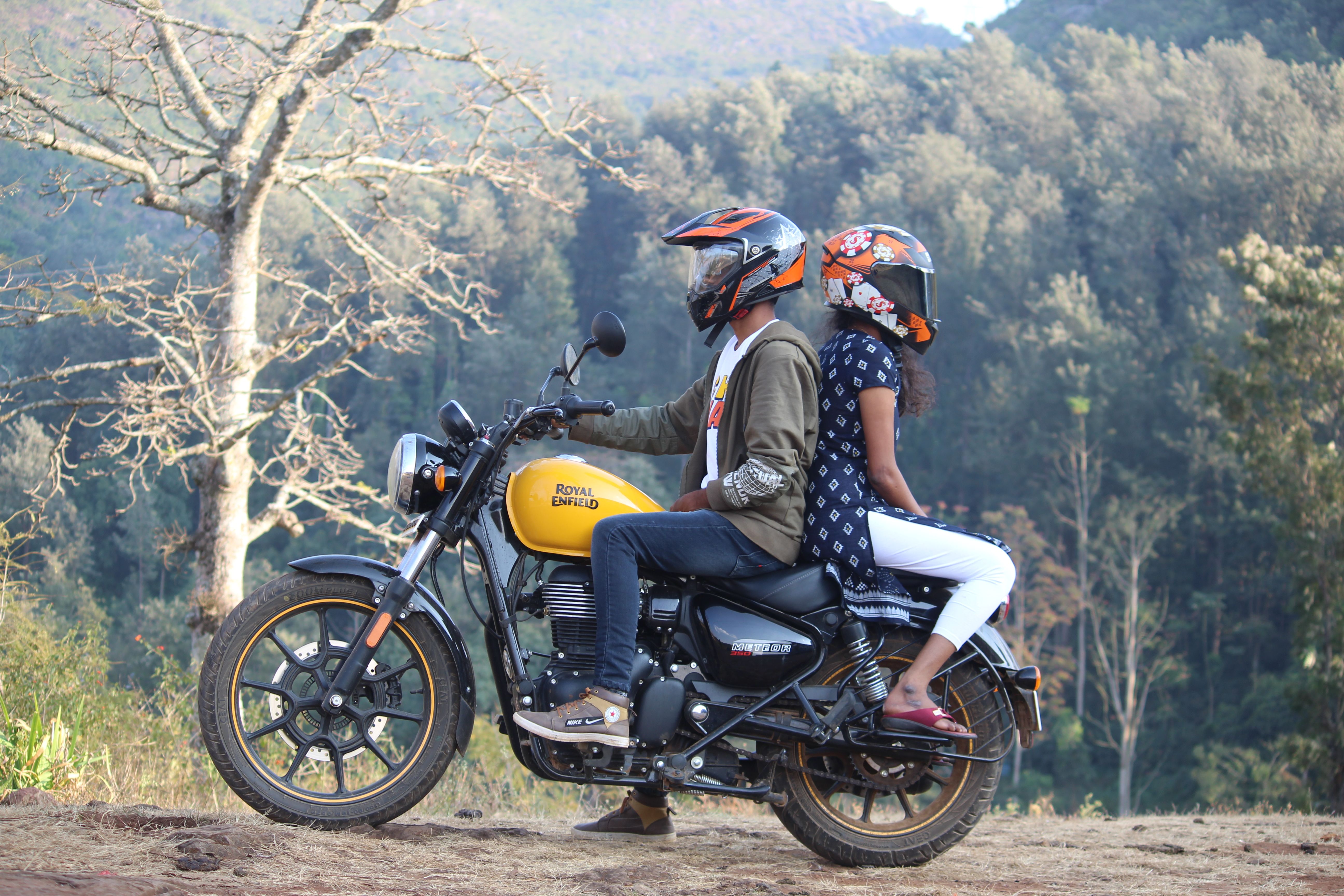 Couple Enjoying a Scenic Motorcycle Ride in Nature · Free Stock Photo