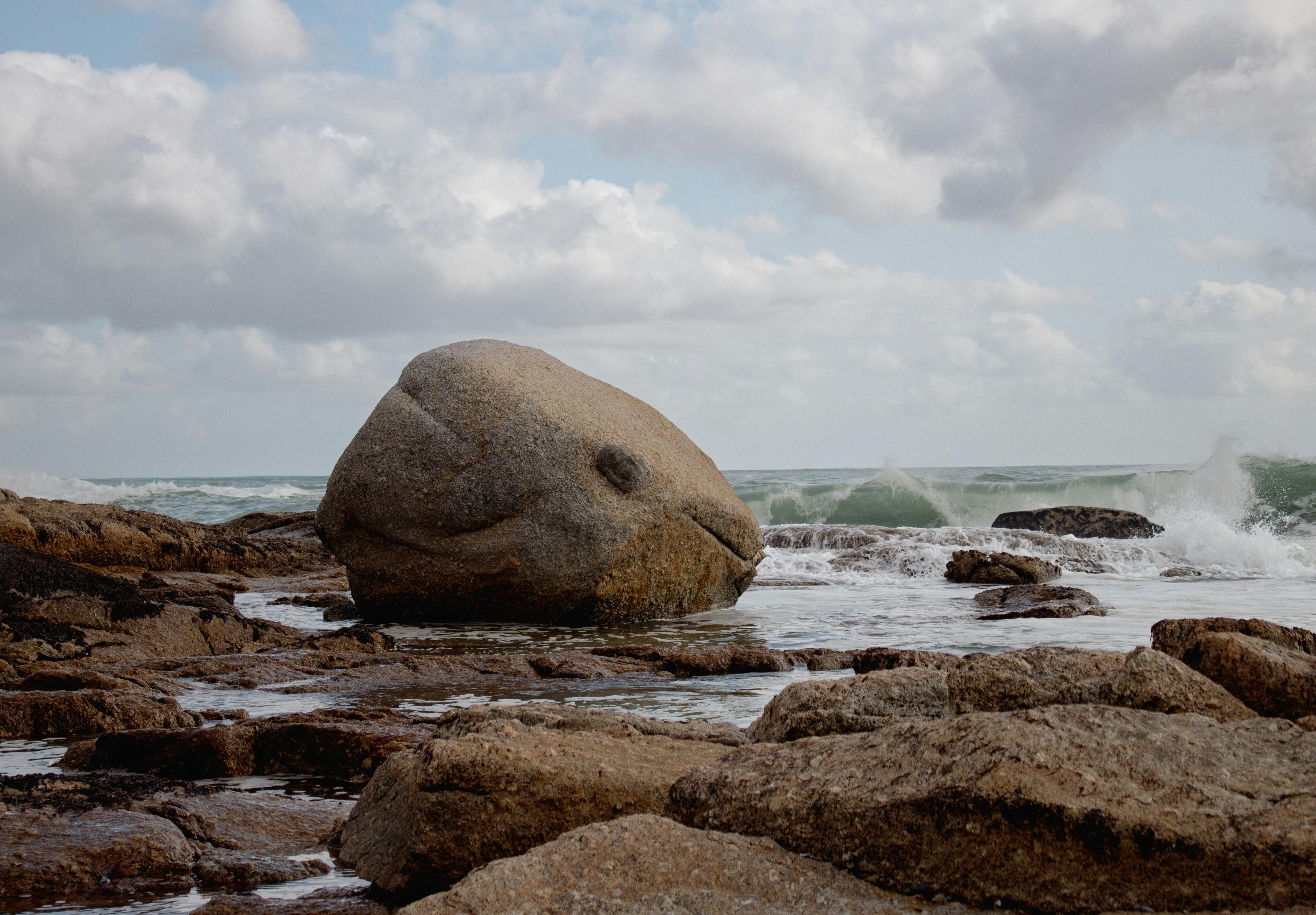 3 Brown Boulders on Seashore during Daytime · Free Stock Photo