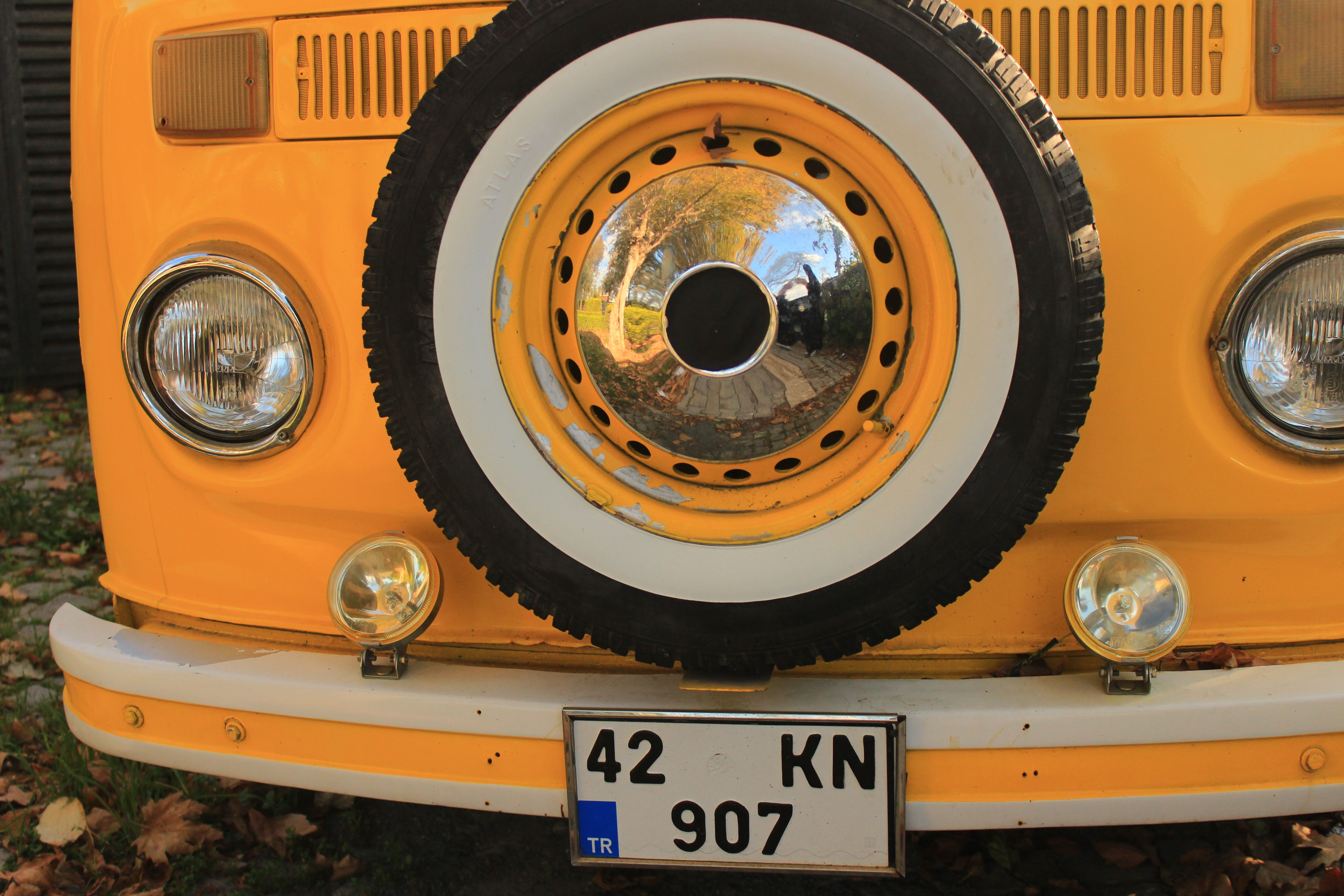 Vintage Yellow Van Front with Reflective Details · Free Stock Photo