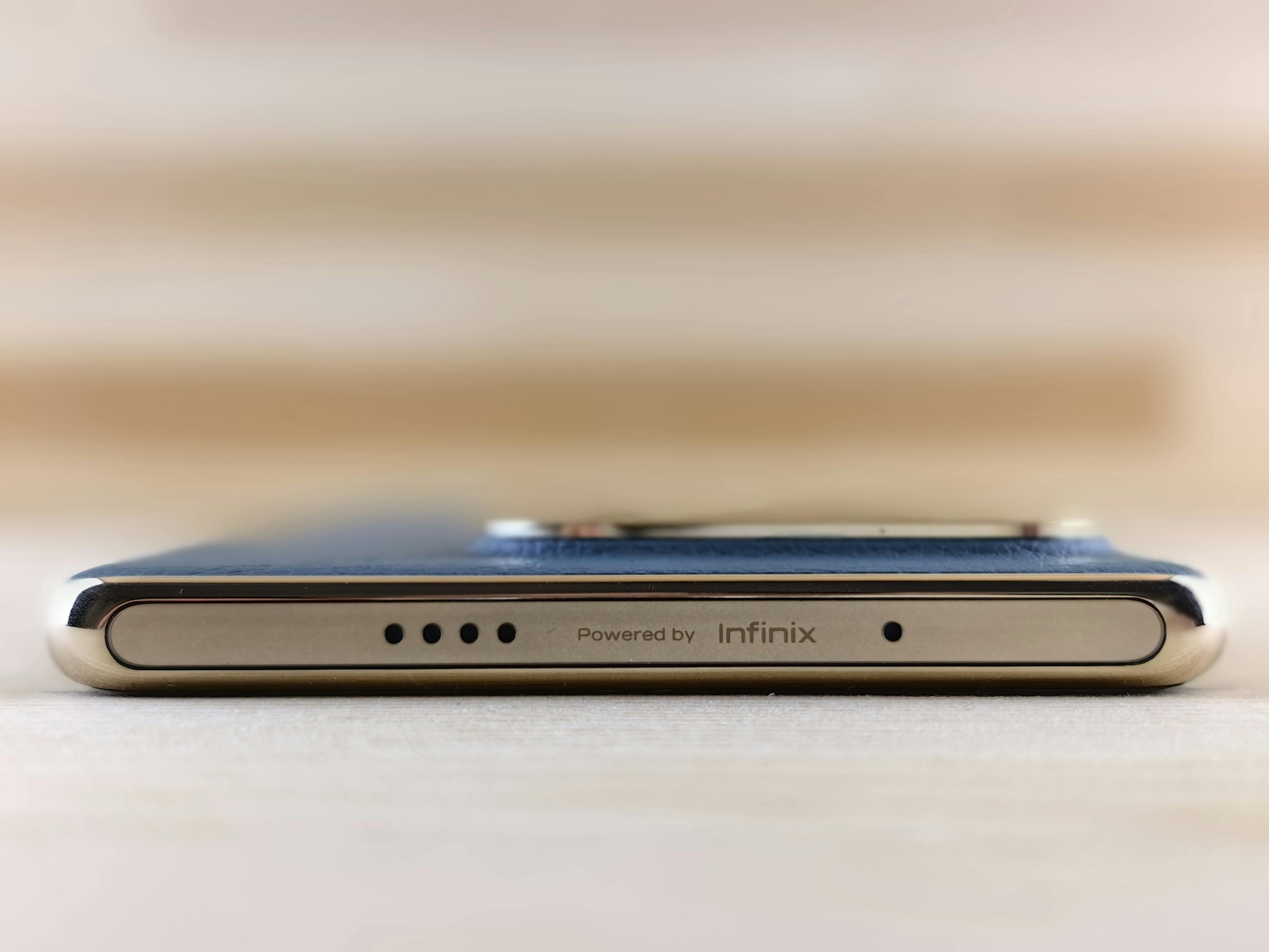Close-Up of a Smartphone Edge with Infinix Branding · Free Stock Photo