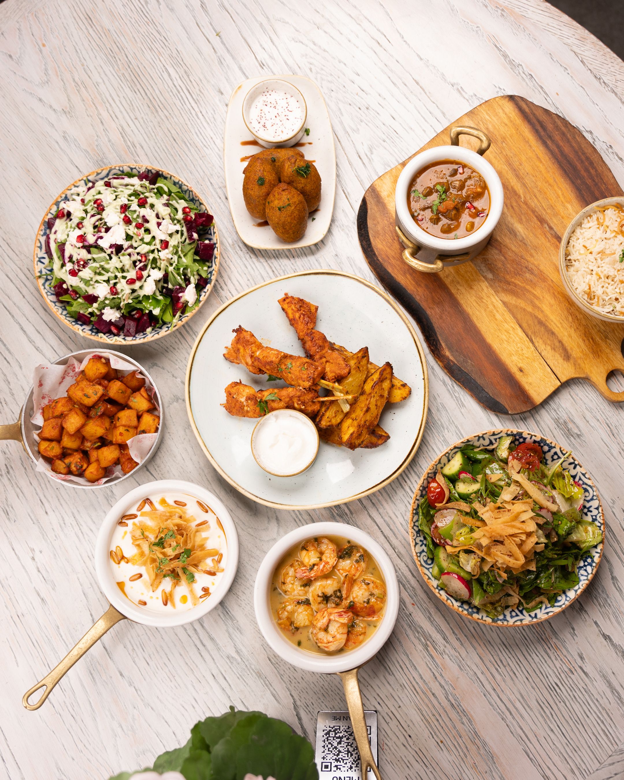 Delicious Mediterranean Food Spread on Table · Free Stock Photo